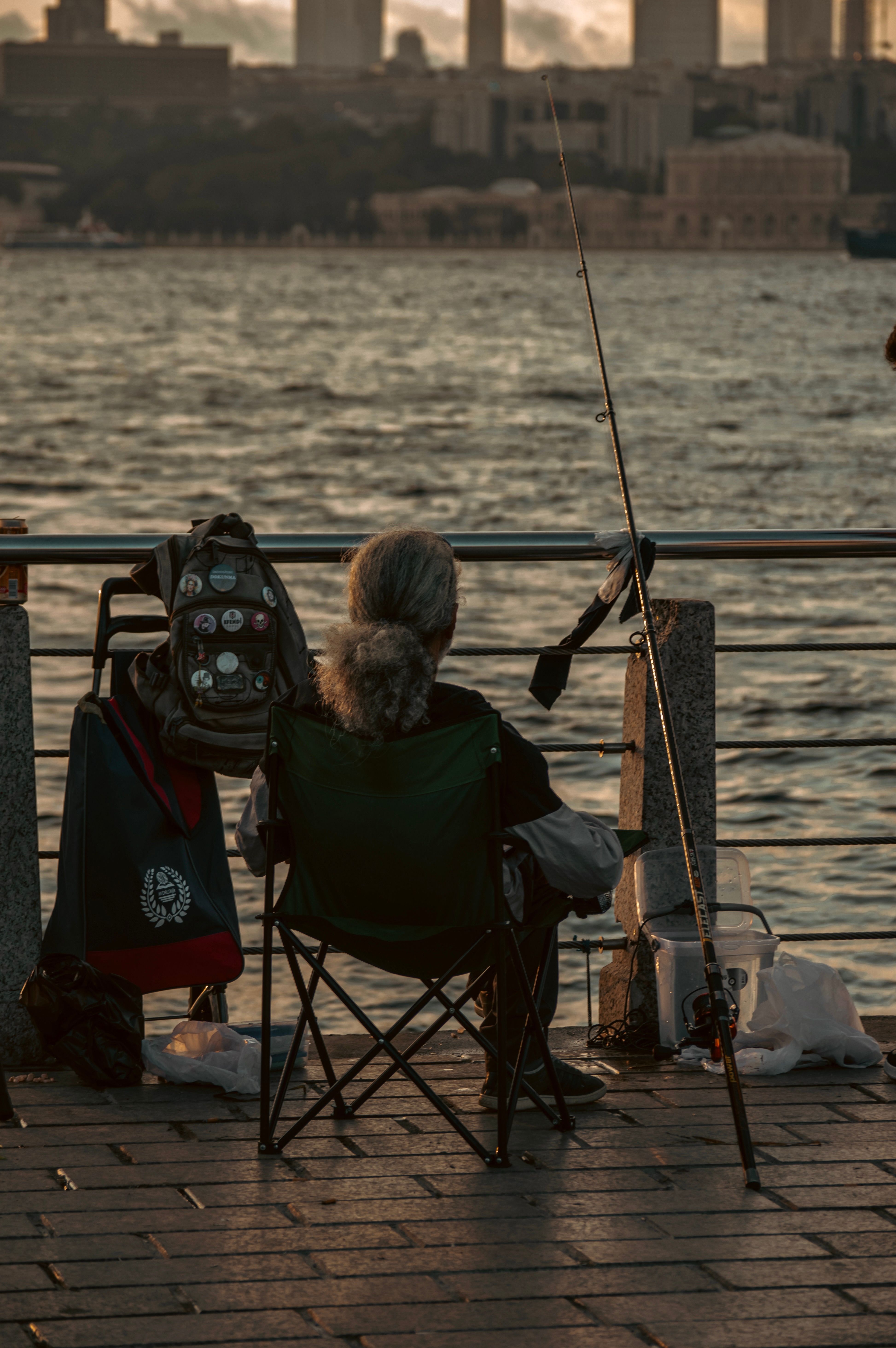 Man Fishing from Bridge · Free Stock Photo