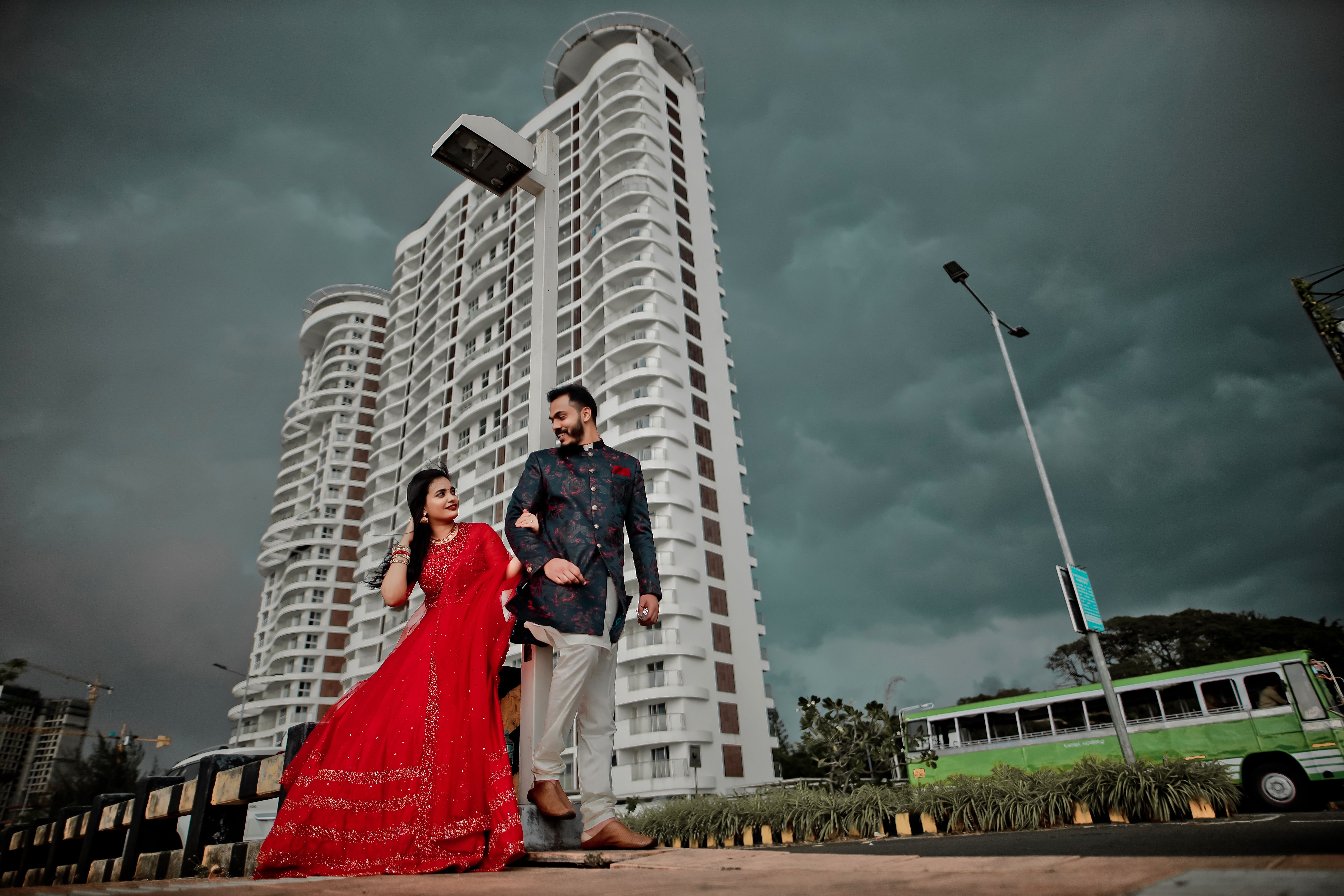 Newlywed Couple Posing for a Photo in front of a City Building · Free ...
