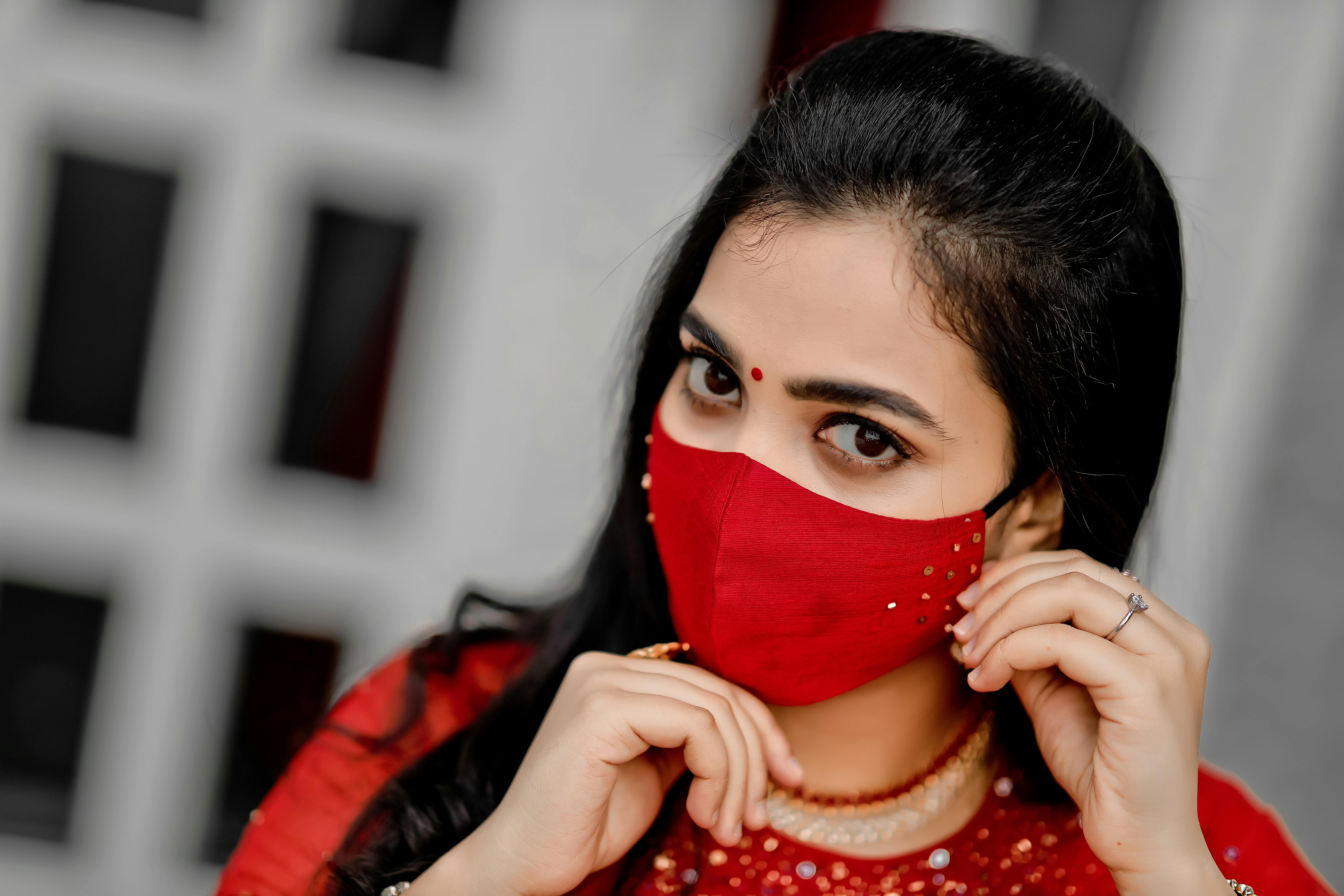 Photo of a Woman Wearing Red Face Mask · Free Stock Photo