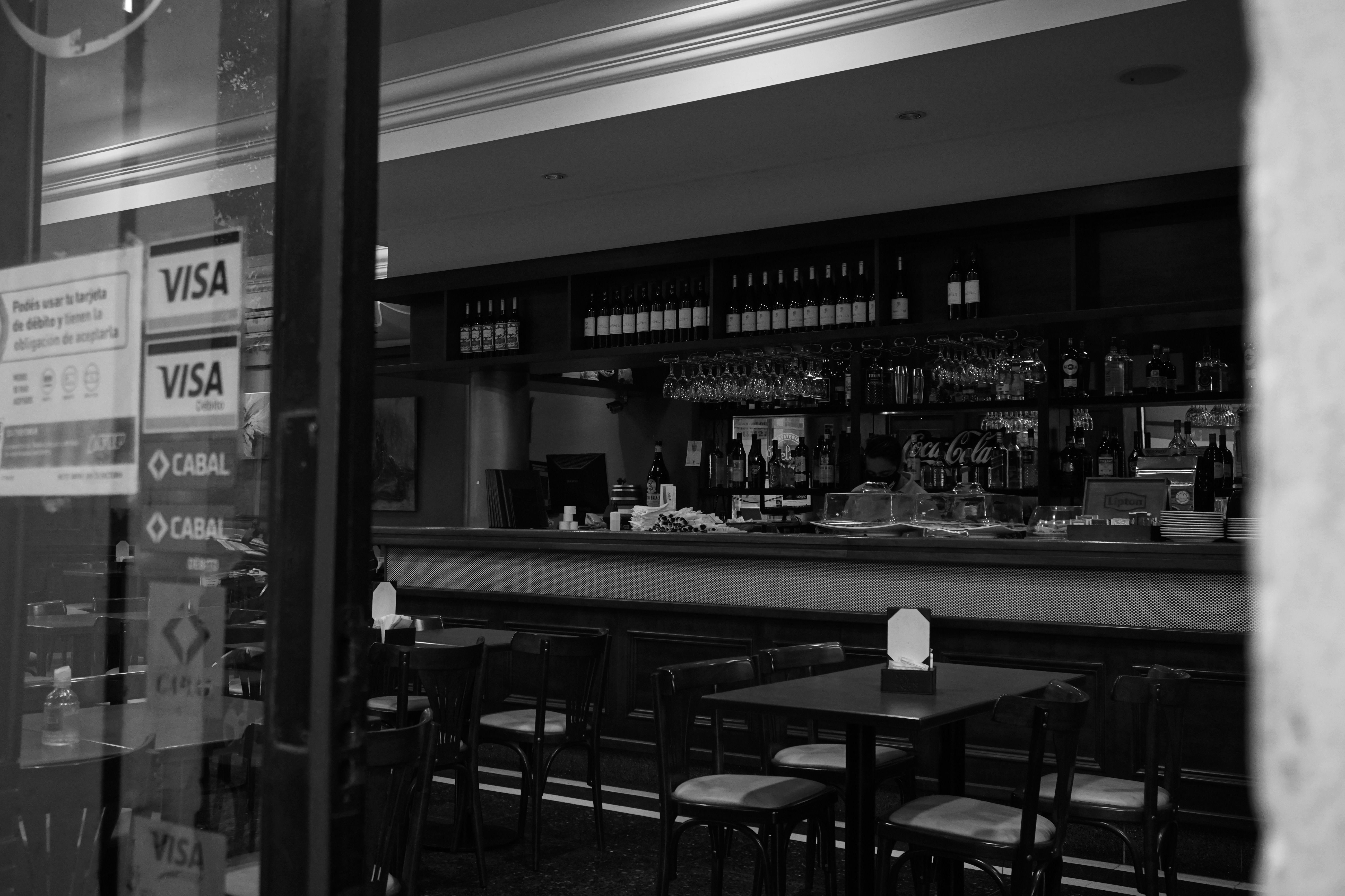 Silhouette Of People Standing Outside A Restaurant · Free Stock Photo