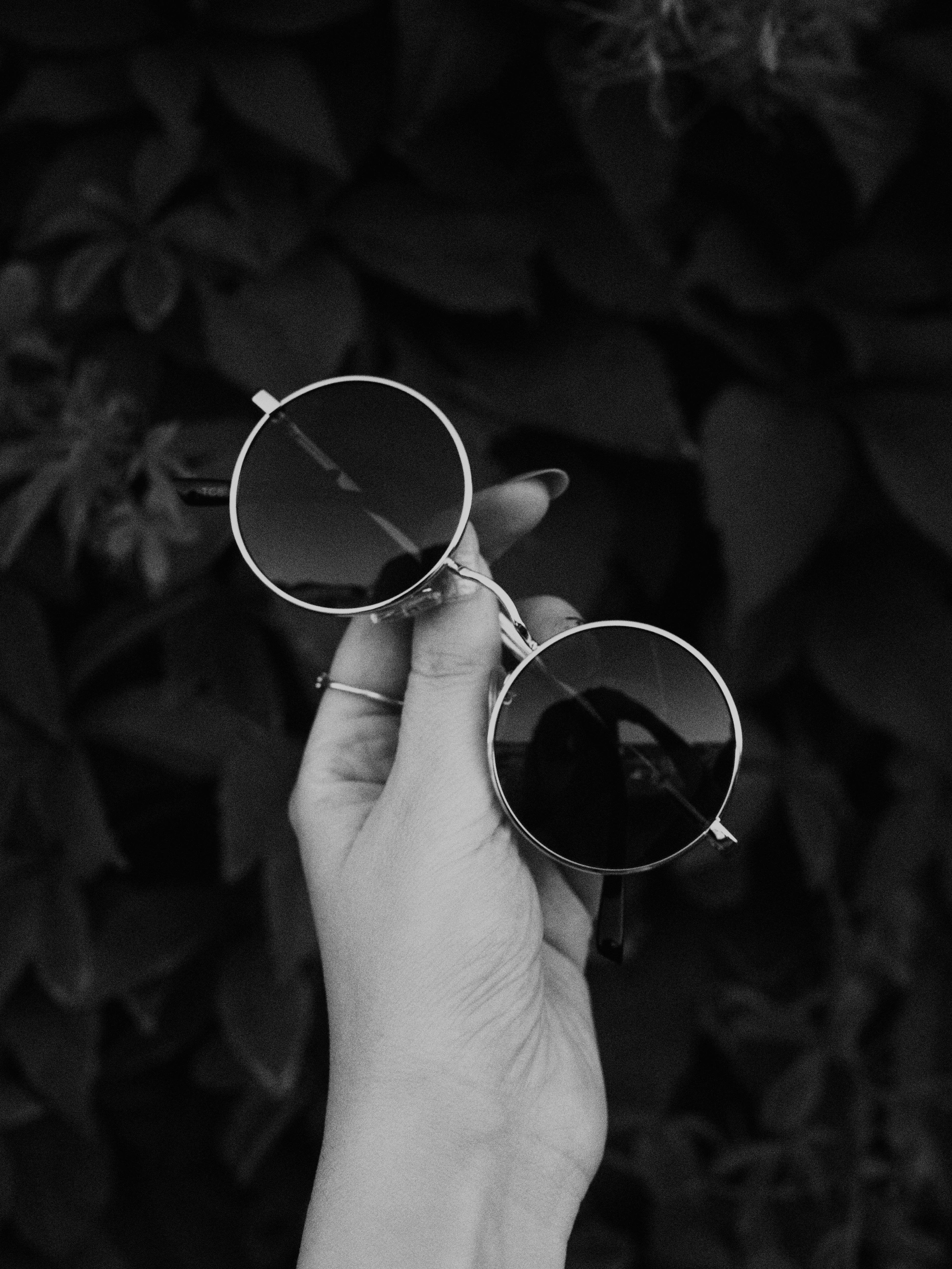 Womans Hand Holding Sunglasses · Free Stock Photo