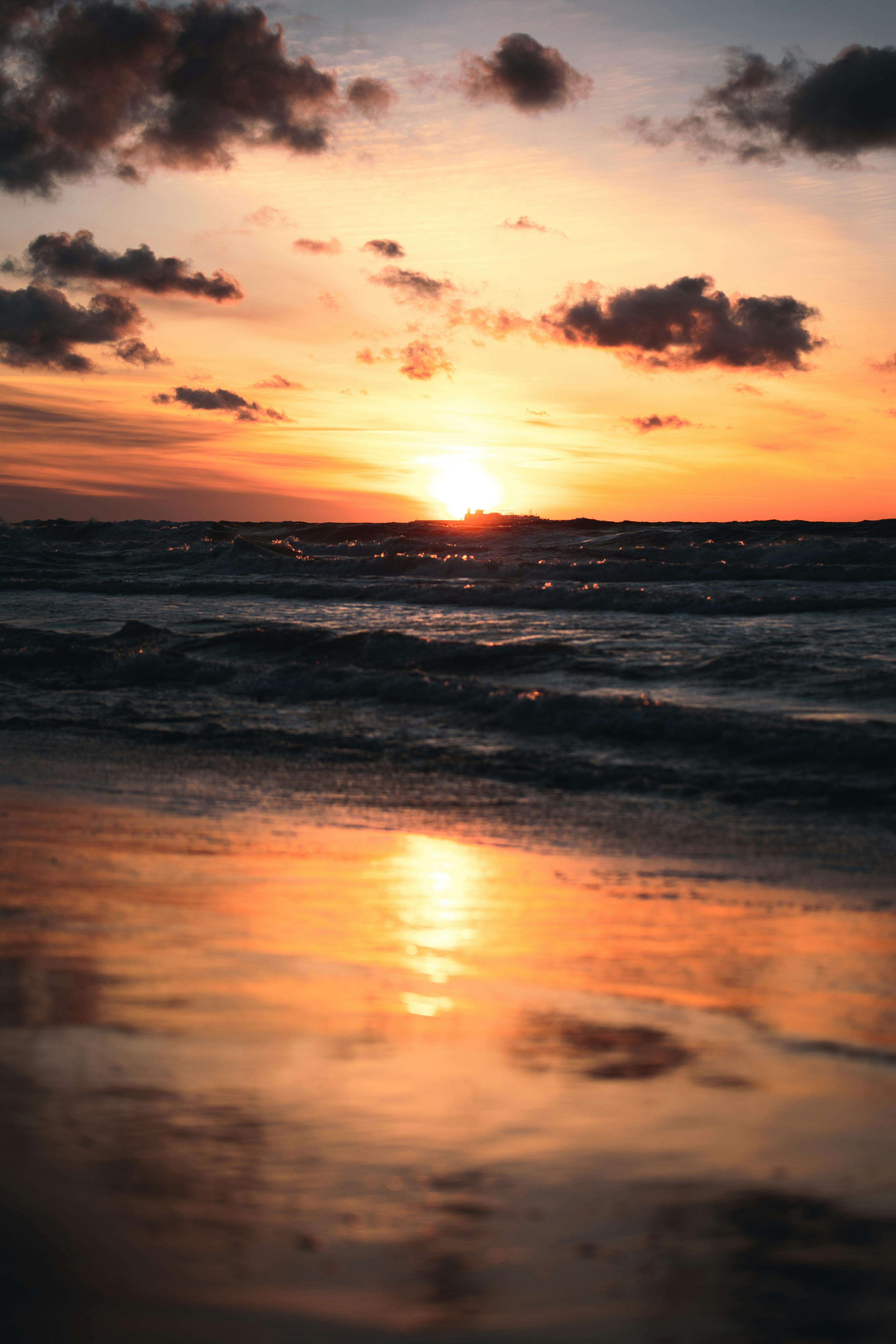 Aerial View of Ocean Waves during Sunset · Free Stock Photo