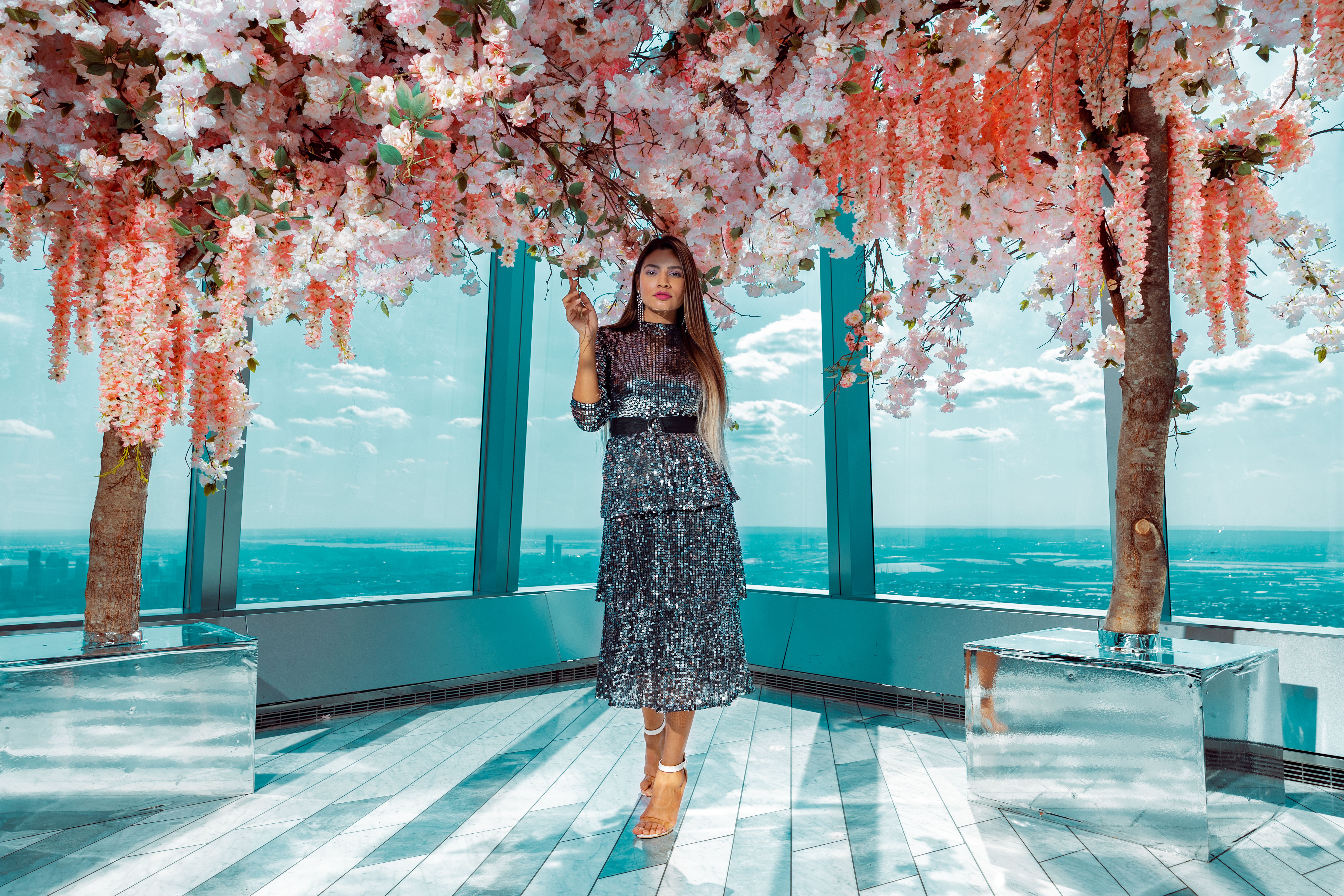 Woman in Dress Standing Under the Flowers · Free Stock Photo