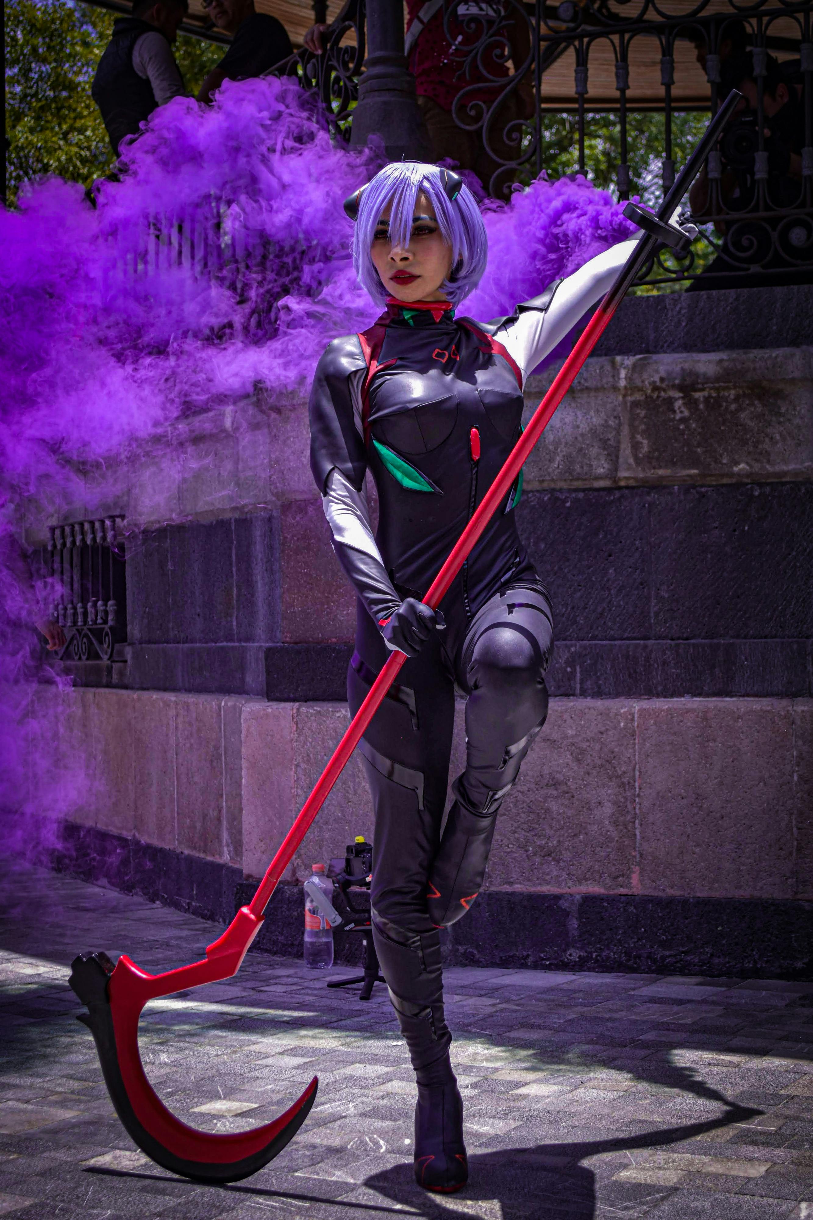 Person in Superhero Cosplay Sitting on Ground · Free Stock Photo