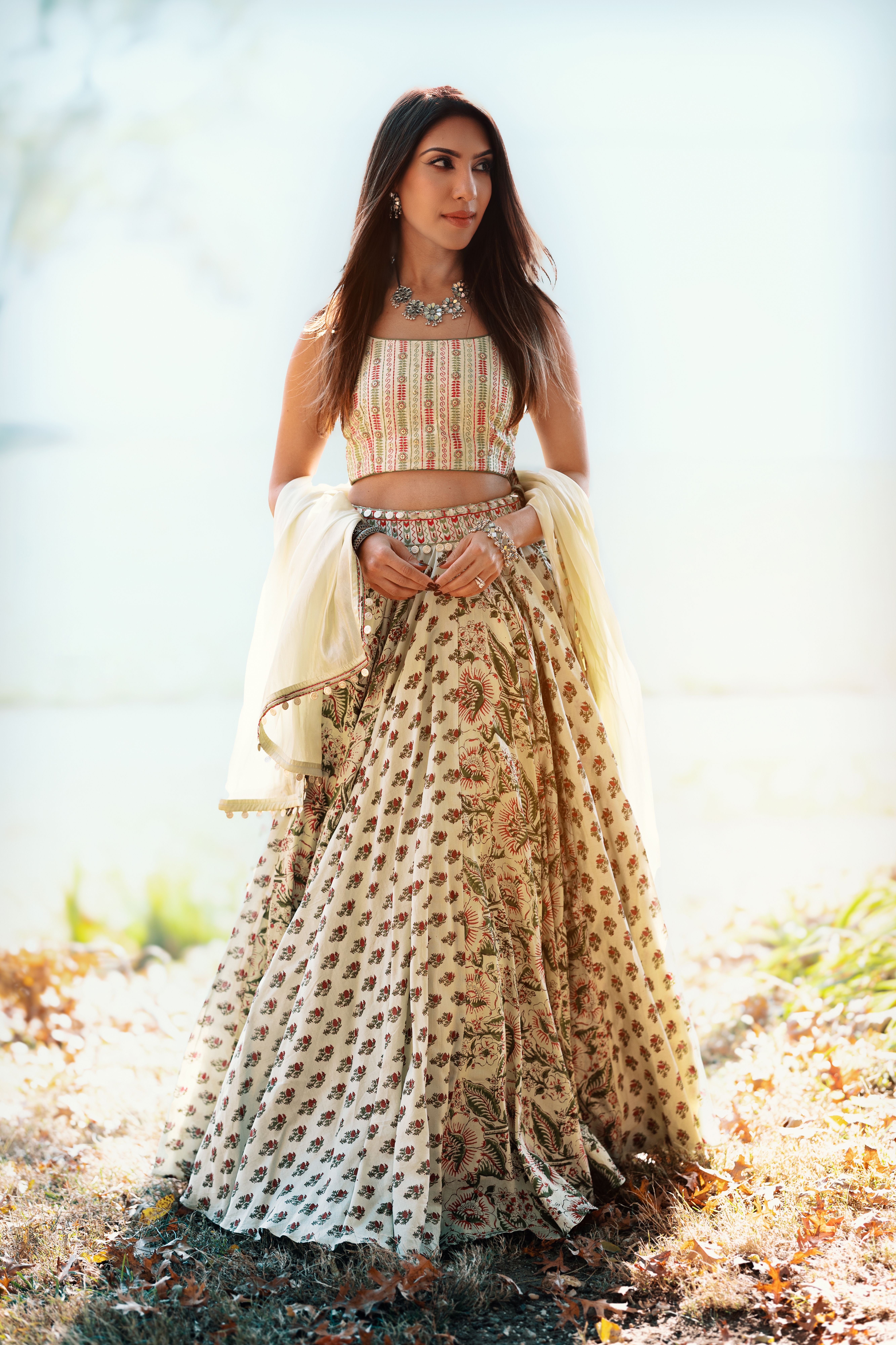 A Woman in Traditional Dress Standing while Looking Afar · Free Stock Photo