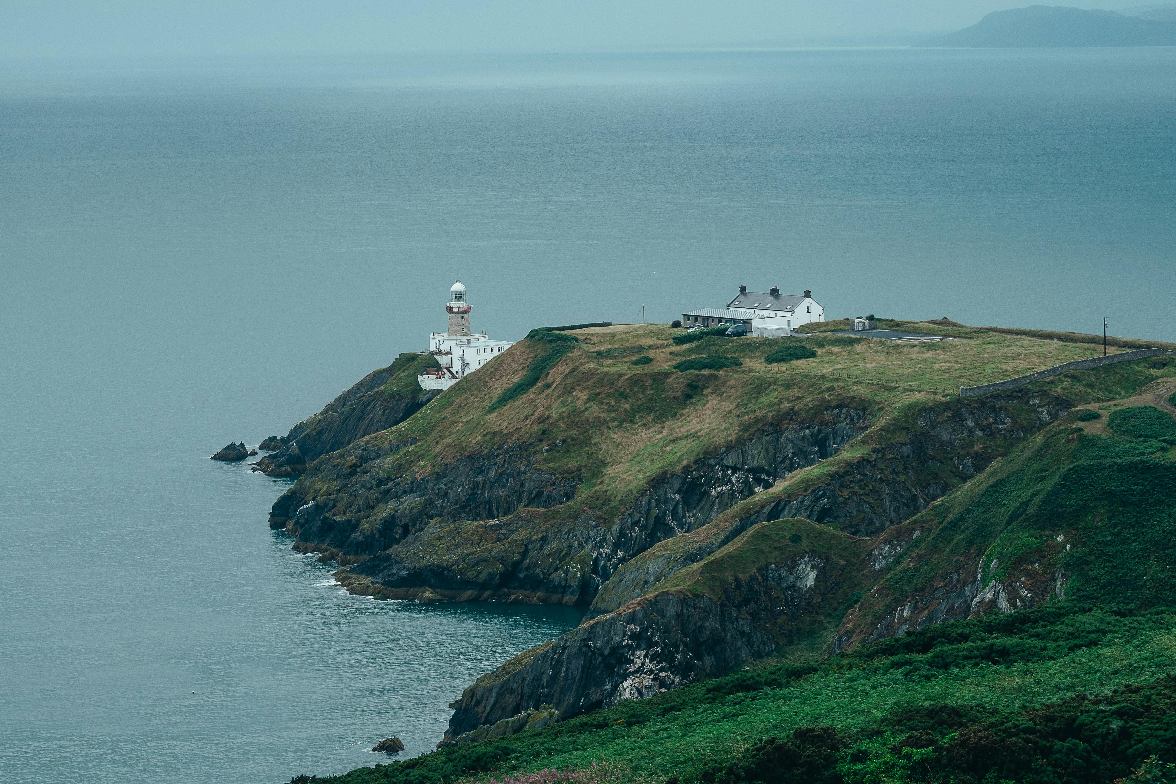 Lighthouse Beside the Ocean · Free Stock Photo