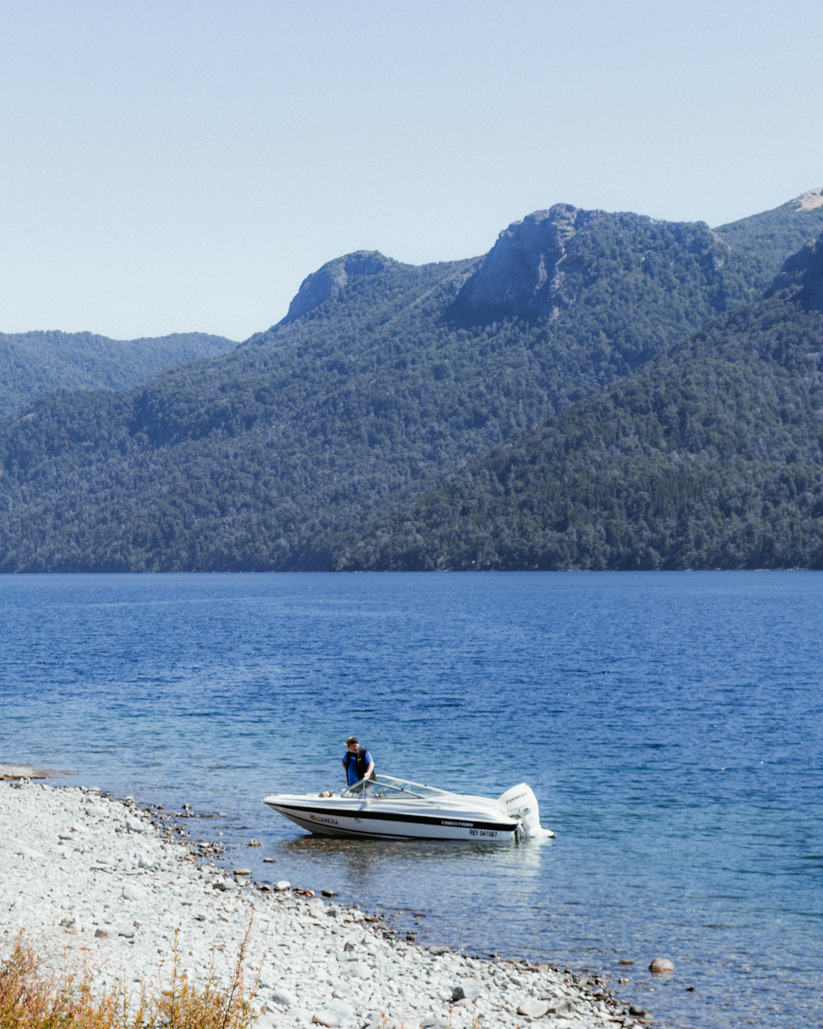 A Man Riding Boat on the Lake · Free Stock Photo