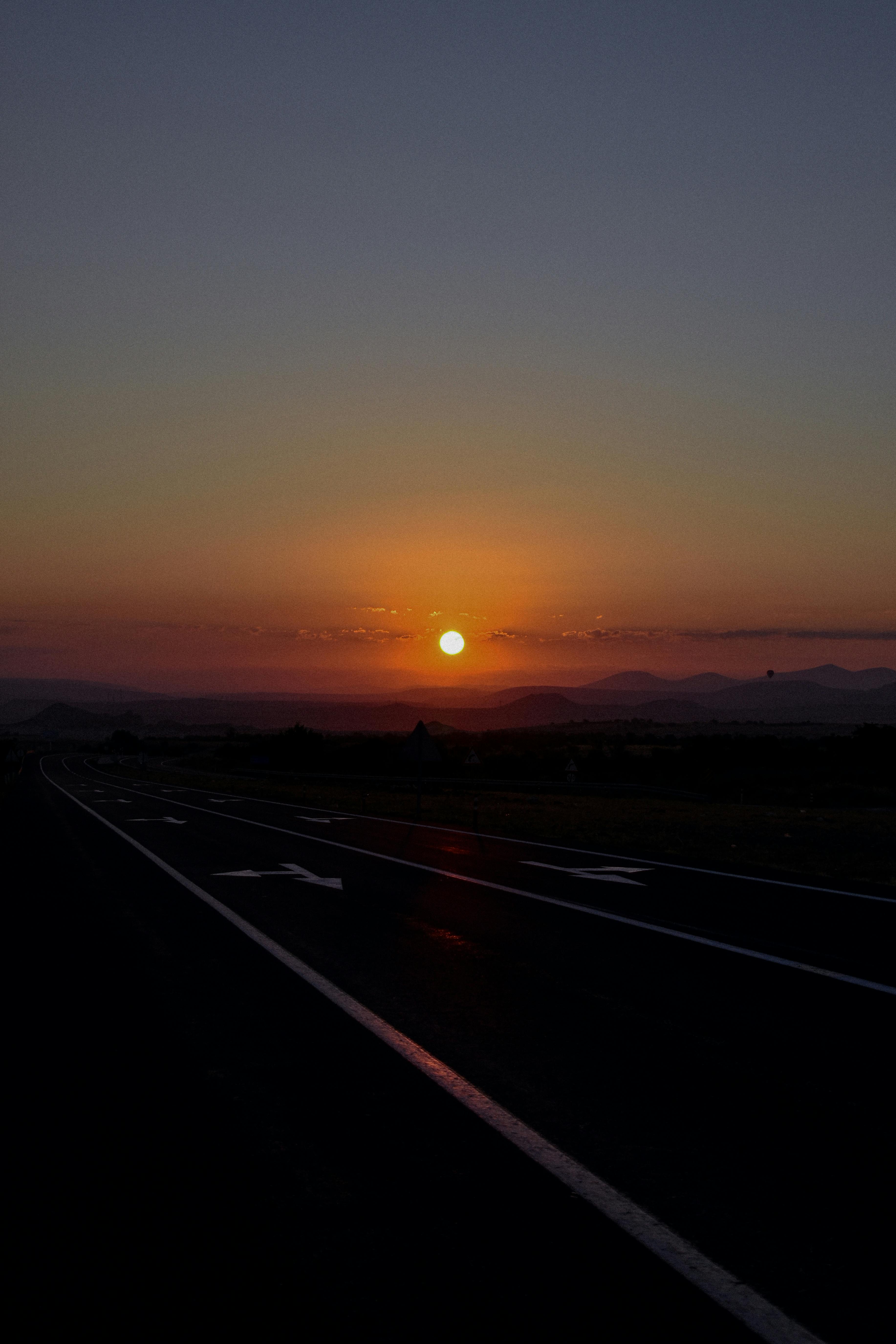Empty Road During Sunset · Free Stock Photo