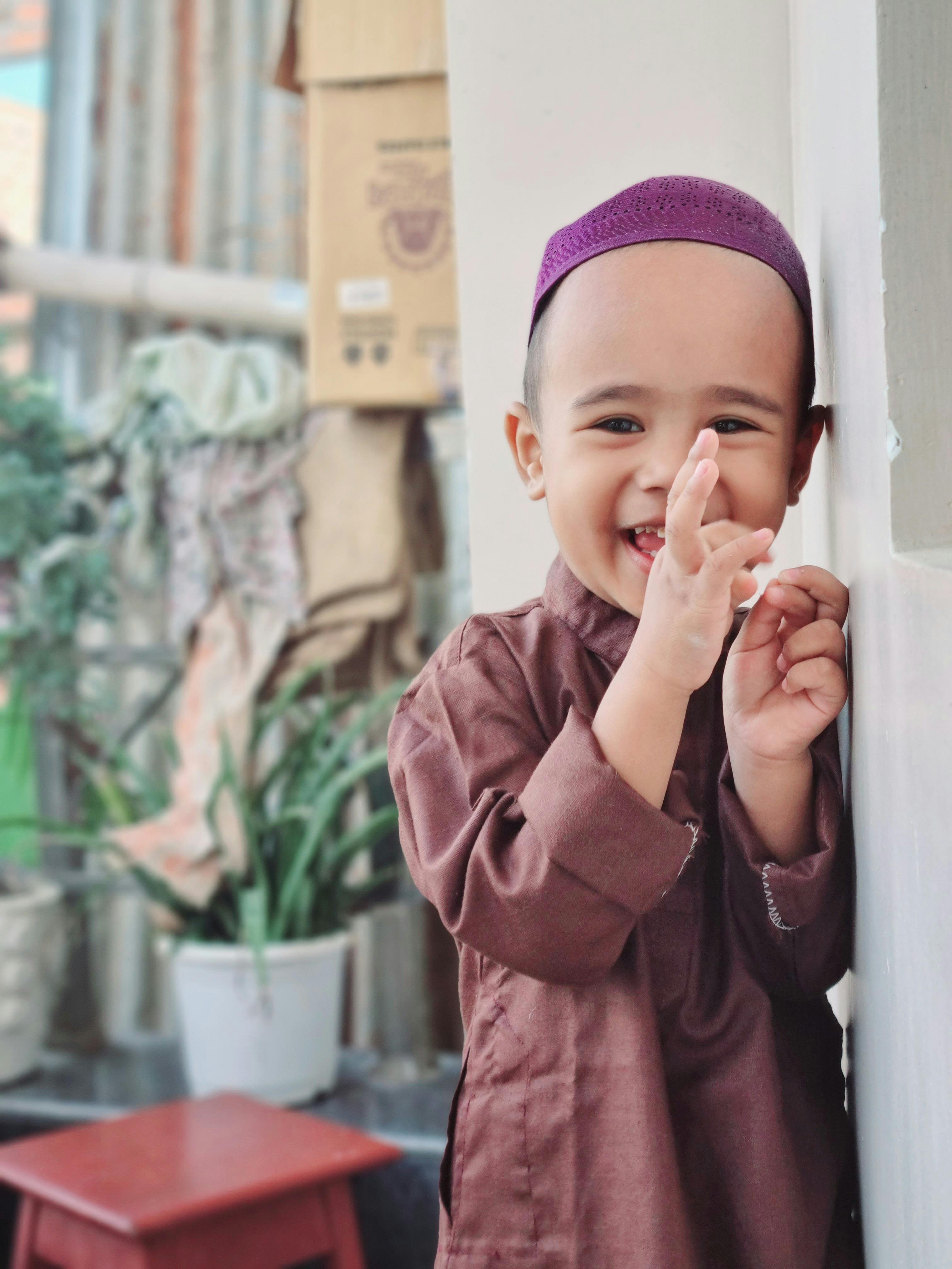 Portrait of a Boy Wearing a Taqiyah Cap · Free Stock Photo