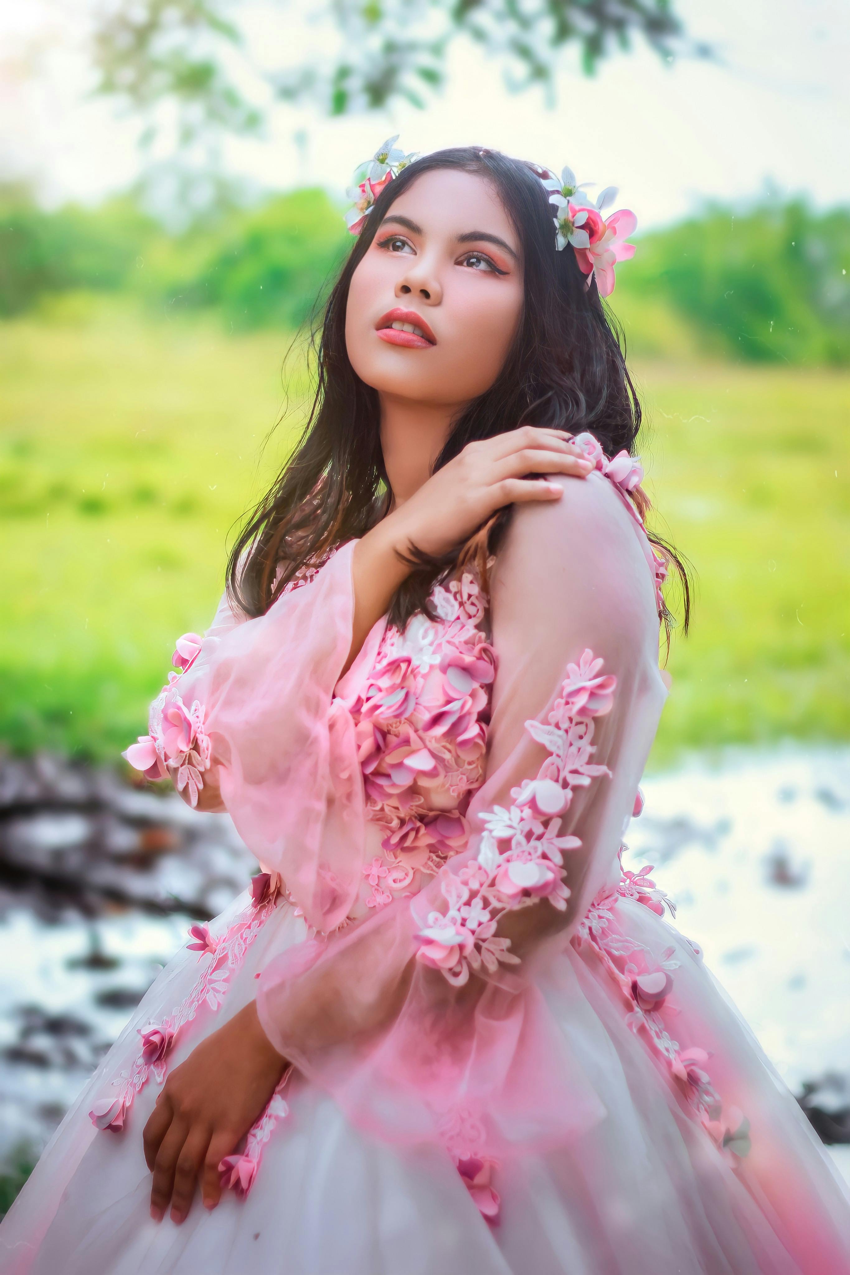 A Woman Wearing a Pink Floral Gown · Free Stock Photo