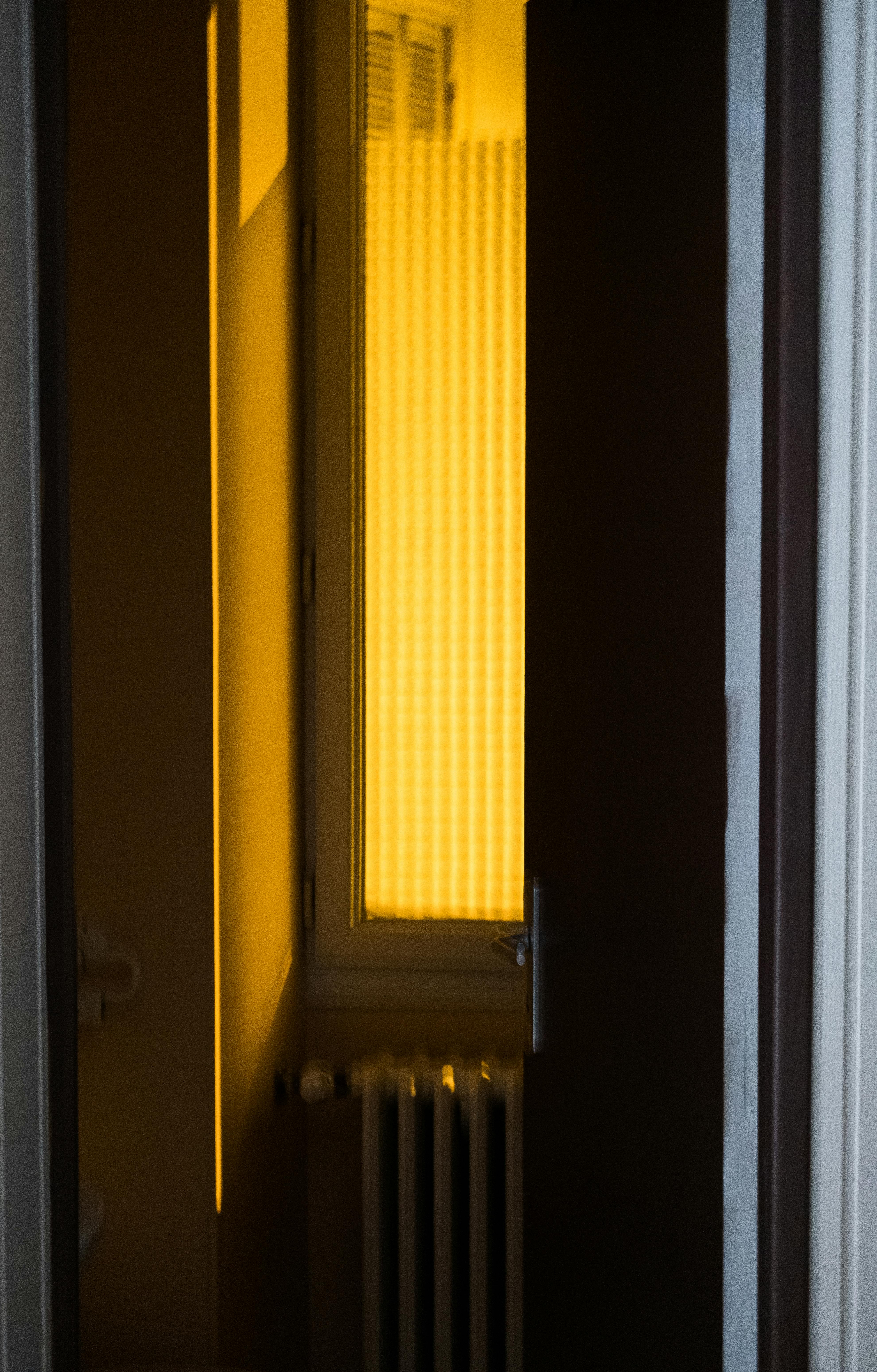 Sunset Sunlight on Narrow Window and Wall · Free Stock Photo