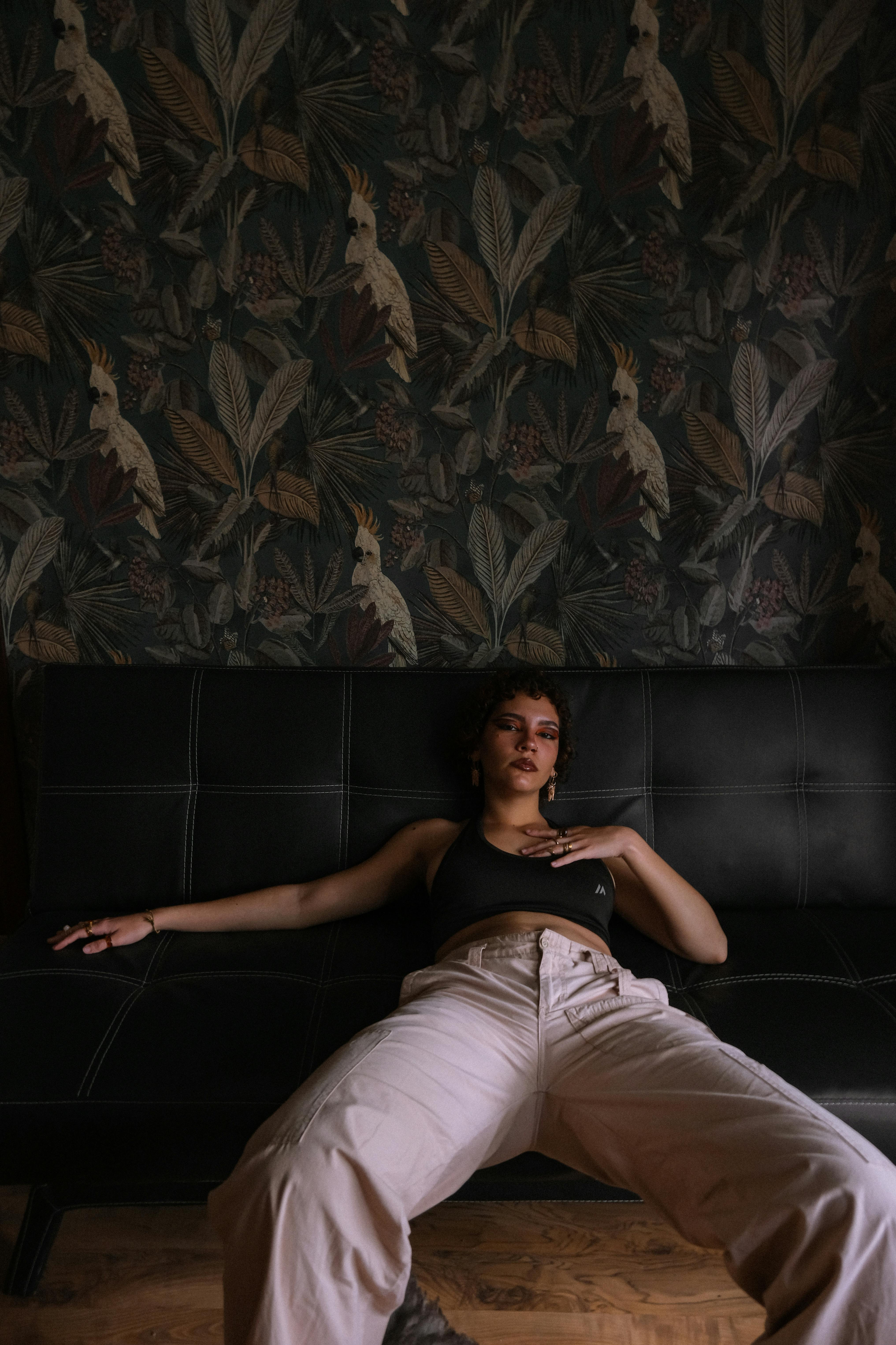 Brunette Posing Sitting on Couch · Free Stock Photo