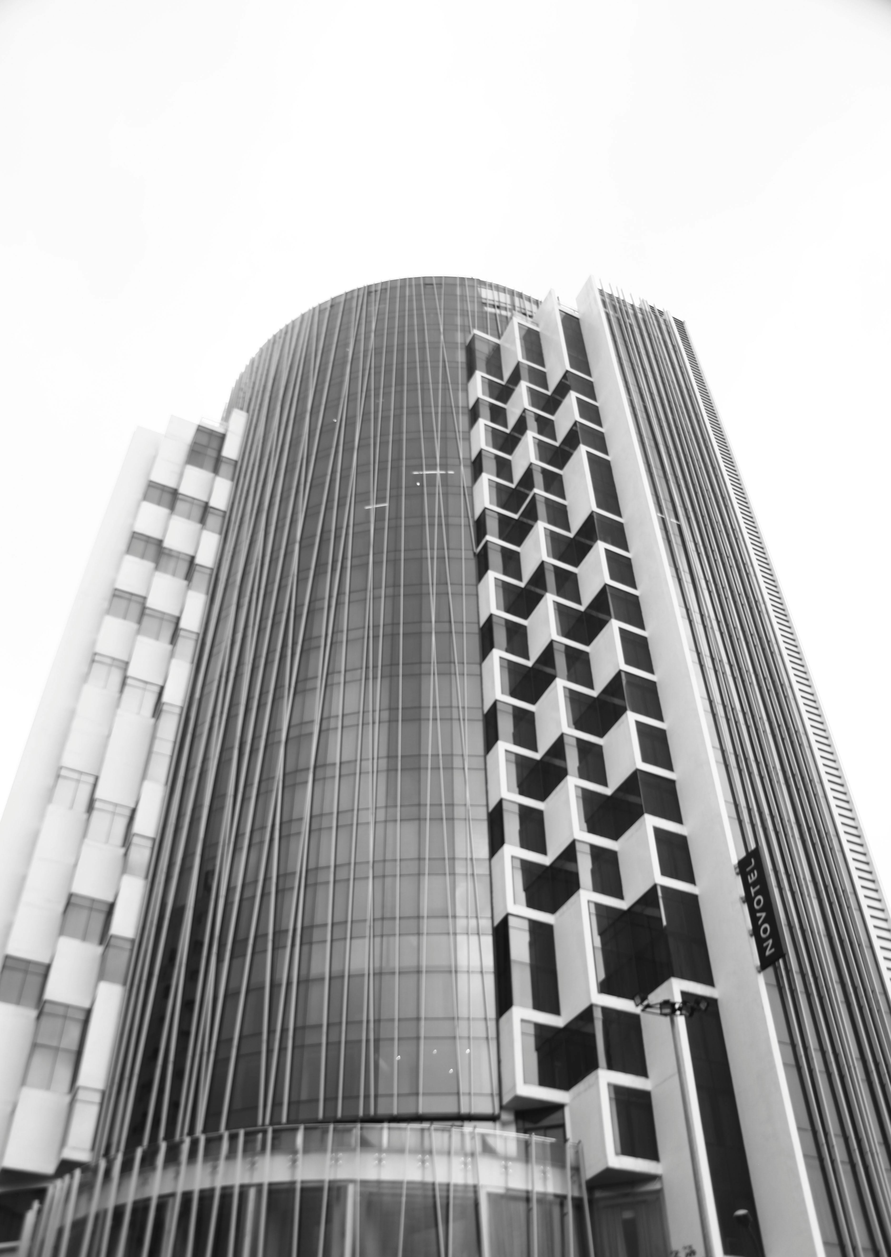 Black and White Low Angle Shot of a Skyscraper · Free Stock Photo
