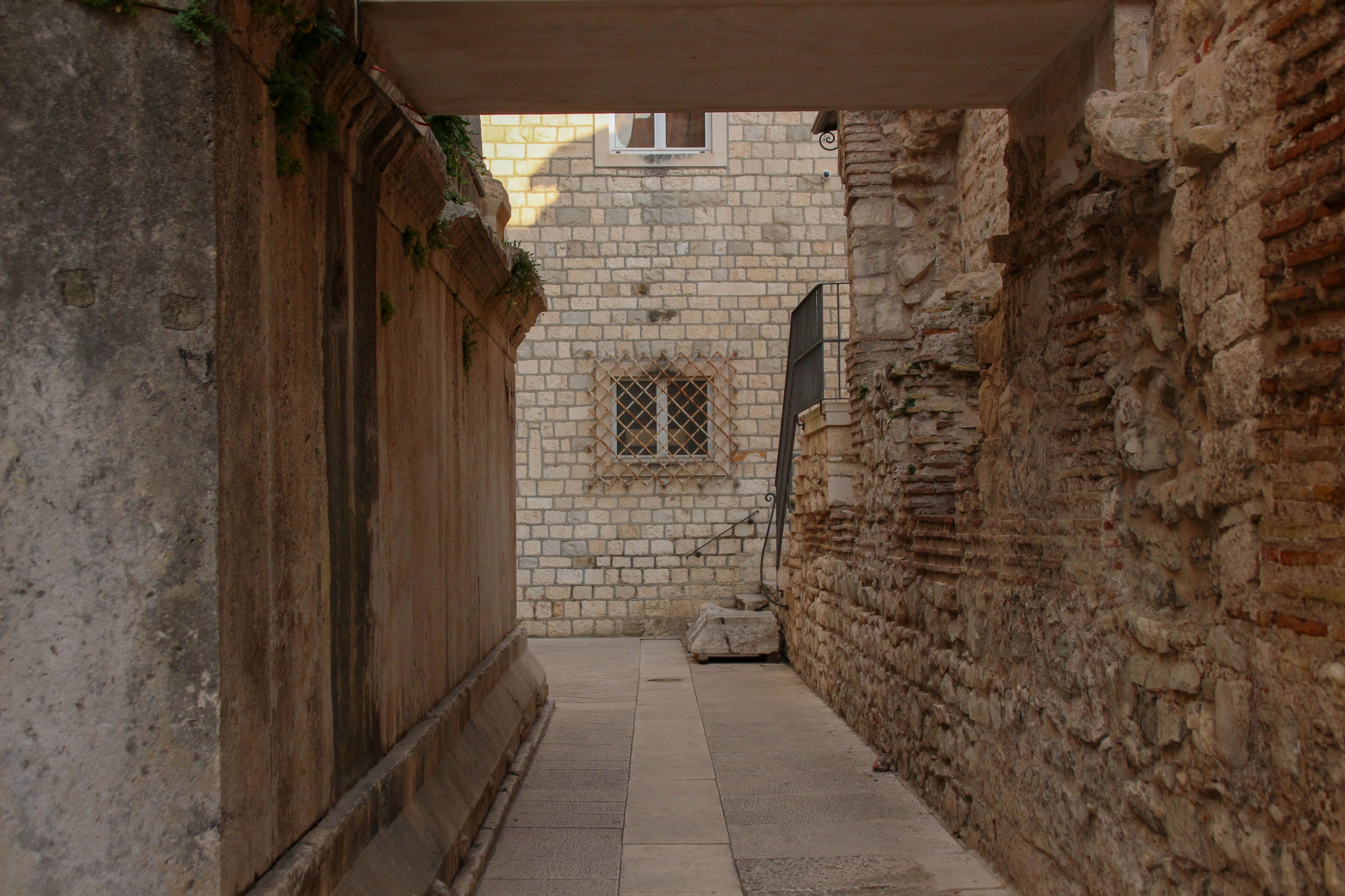Narrow Alley of Stone and Brick Wall · Free Stock Photo