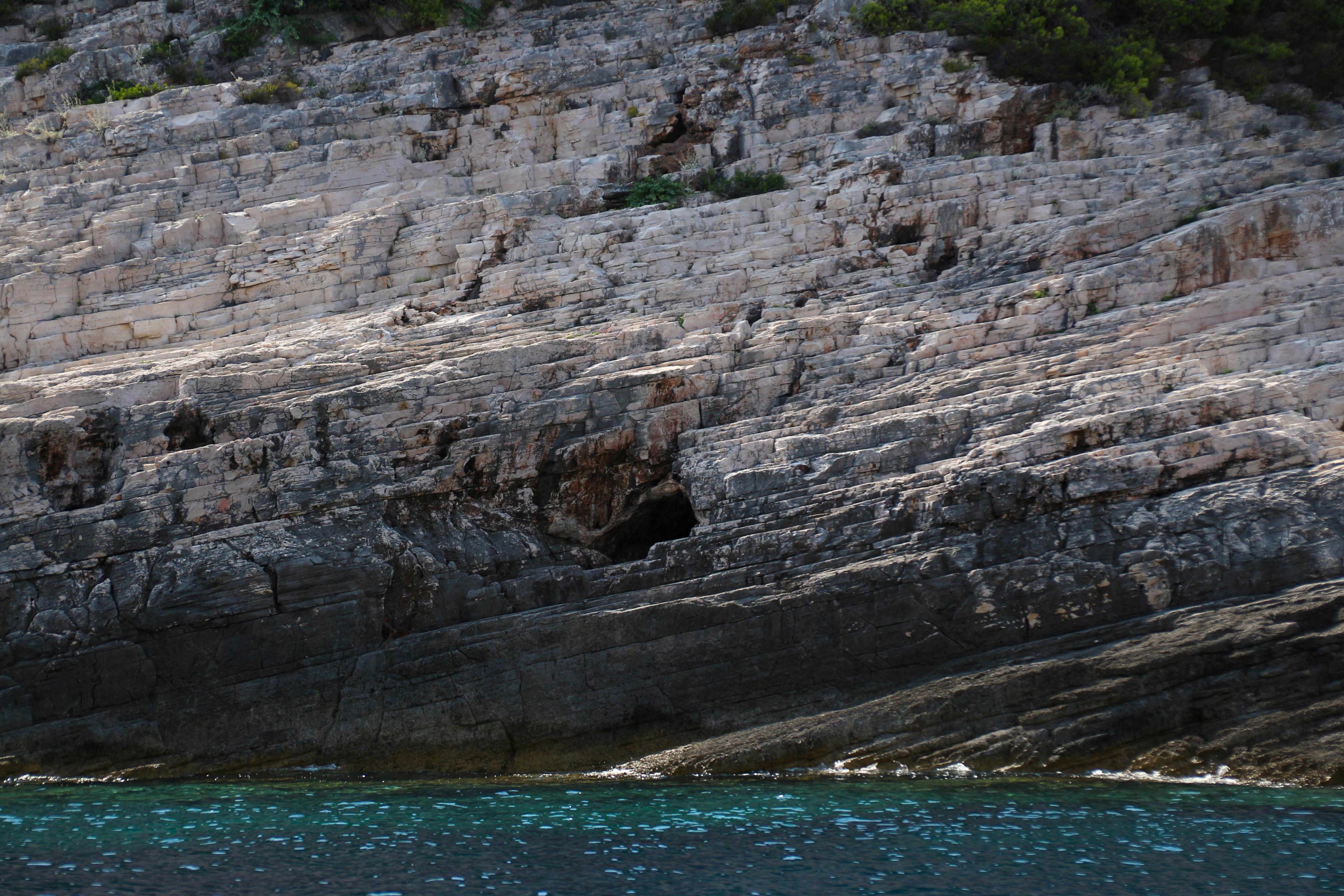 Rock Cliff Beside the Ocean · Free Stock Photo