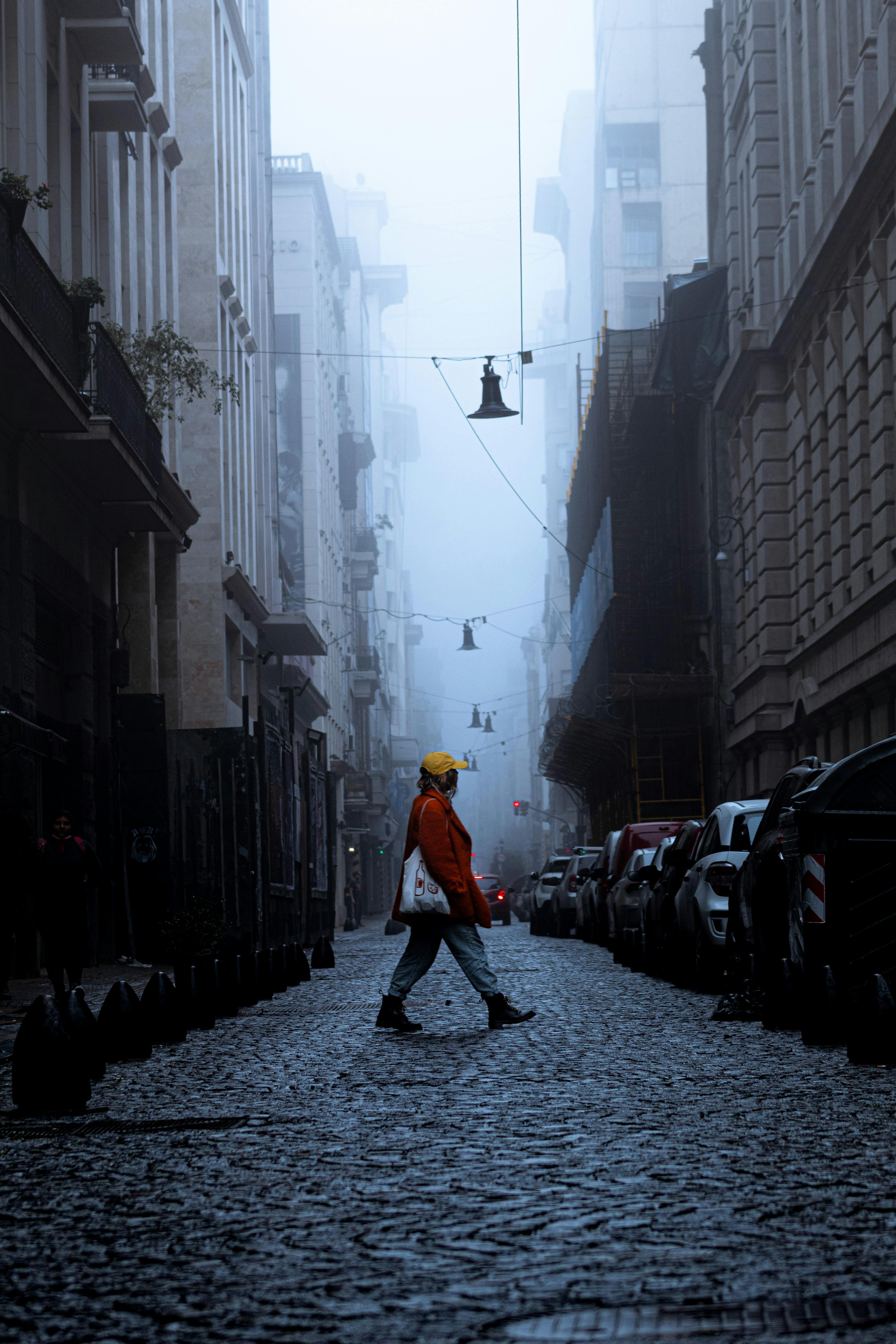 3 People Walking in the Middle of the Street · Free Stock Photo