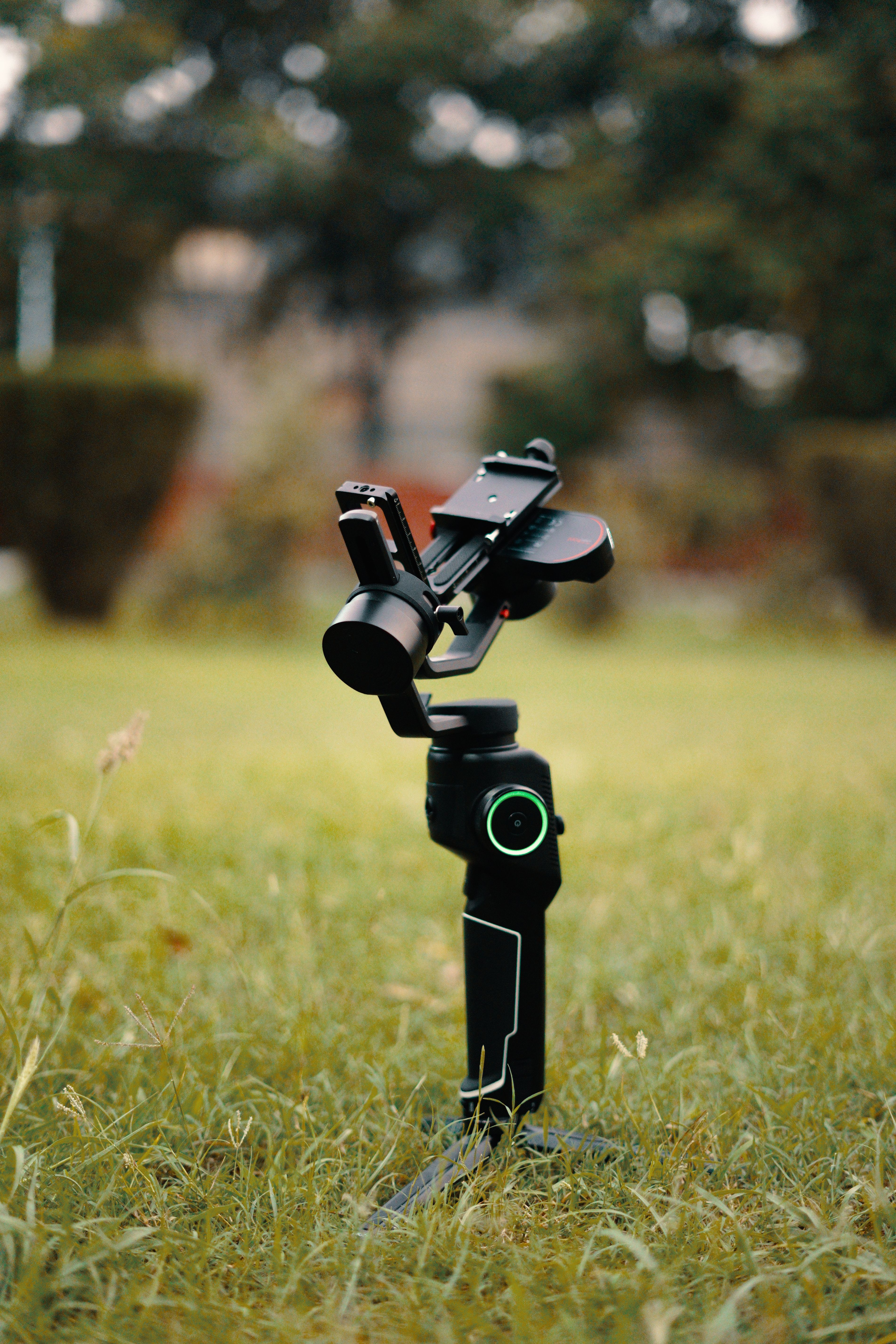 A Handheld Gimbal on the Grass · Free Stock Photo