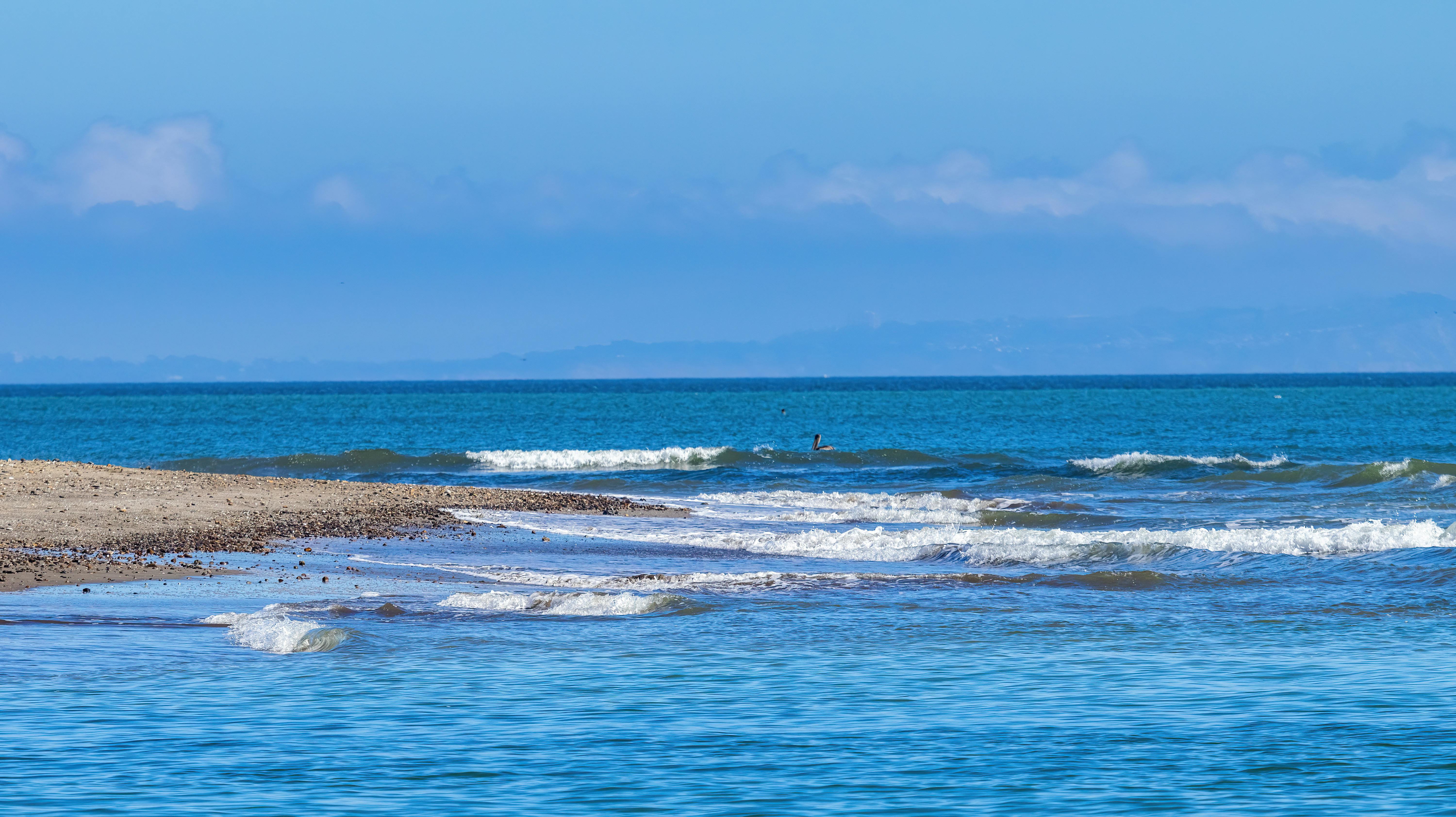 Ocean View of Beautiful Calm Sea Under Blue Sky · Free Stock Photo