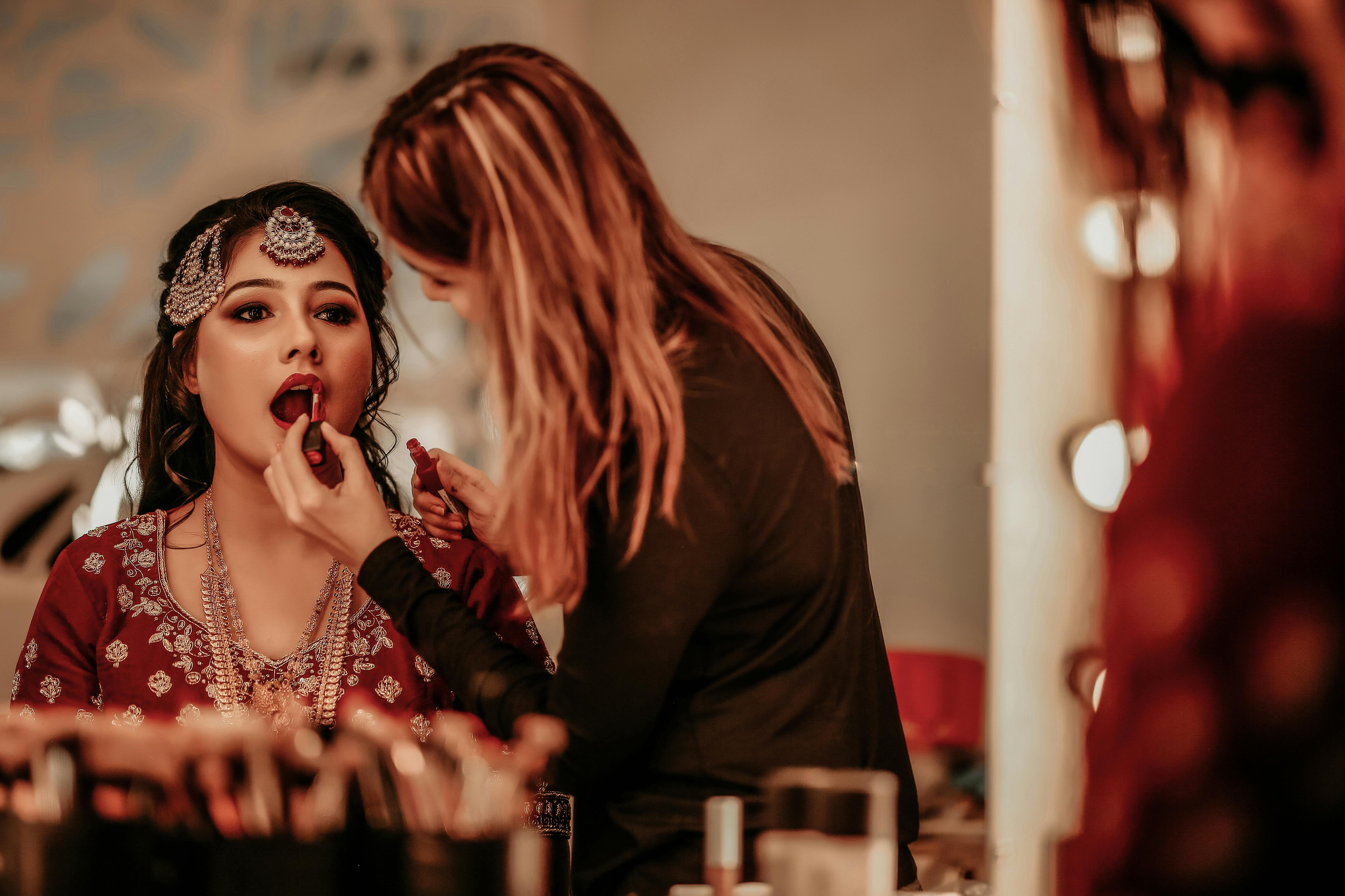 Woman Getting Her Makeup Done · Free Stock Photo