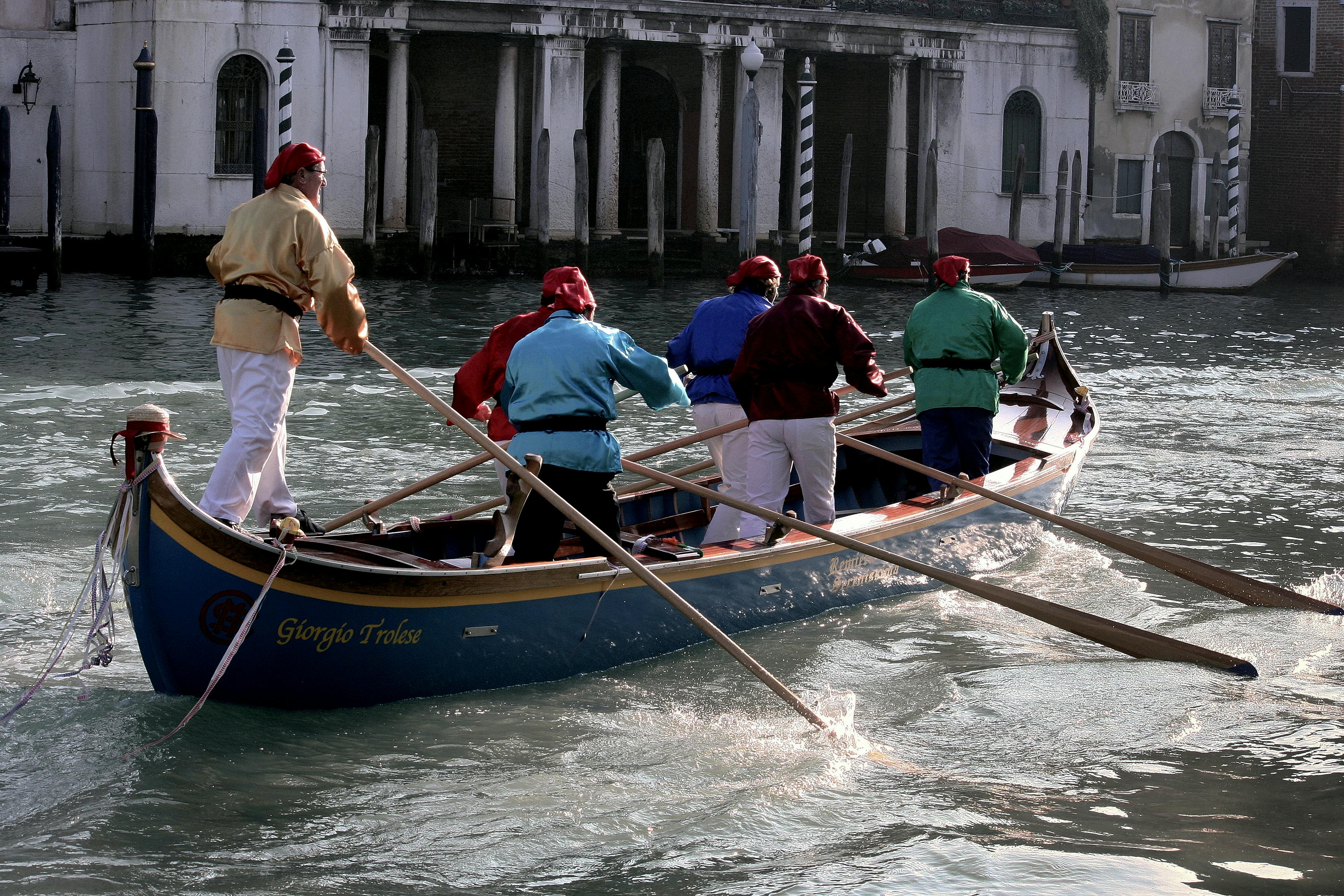 Men Rowing a Boat on Water Canal · Free Stock Photo