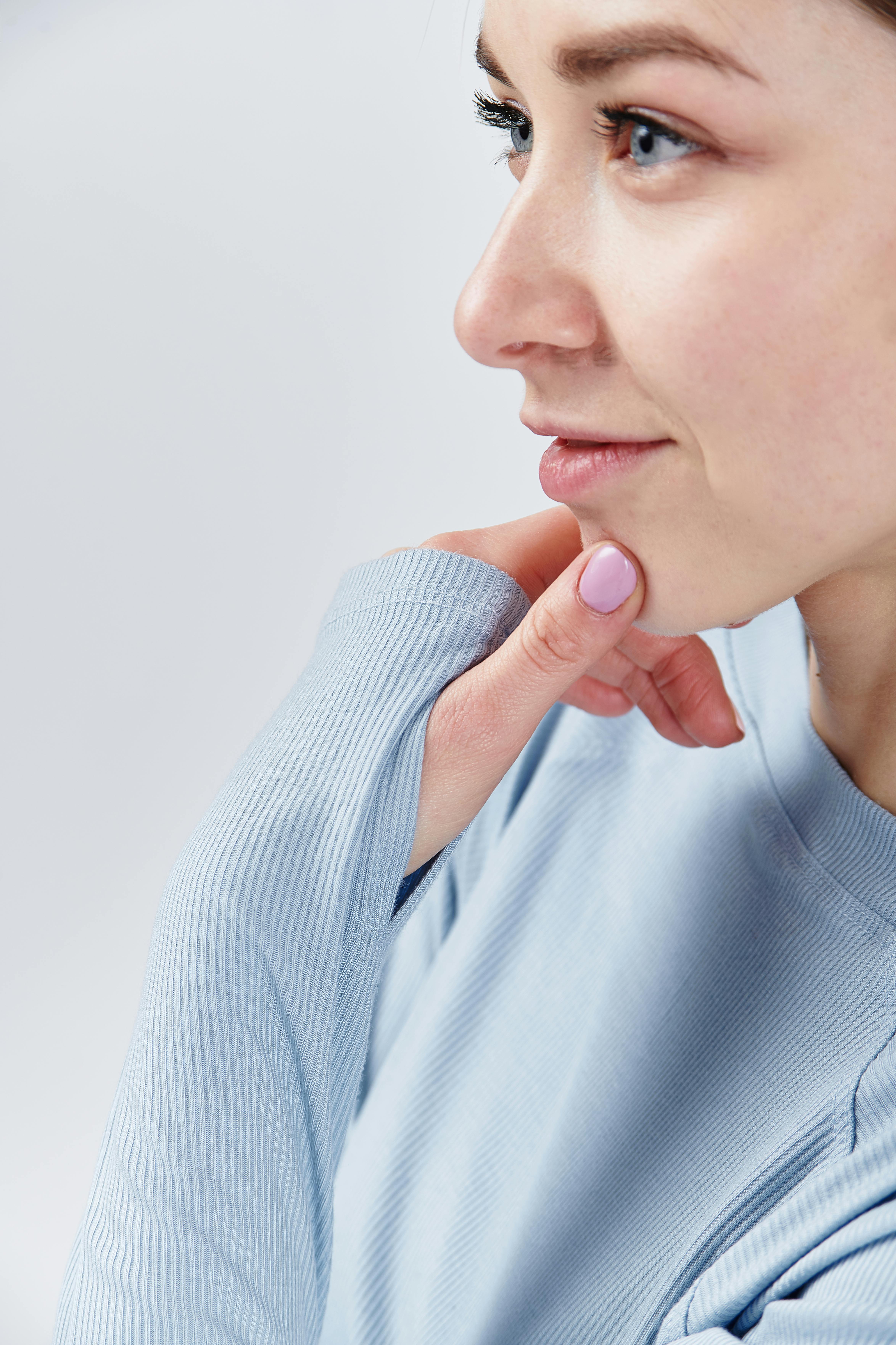 Woman Touching her Chin · Free Stock Photo