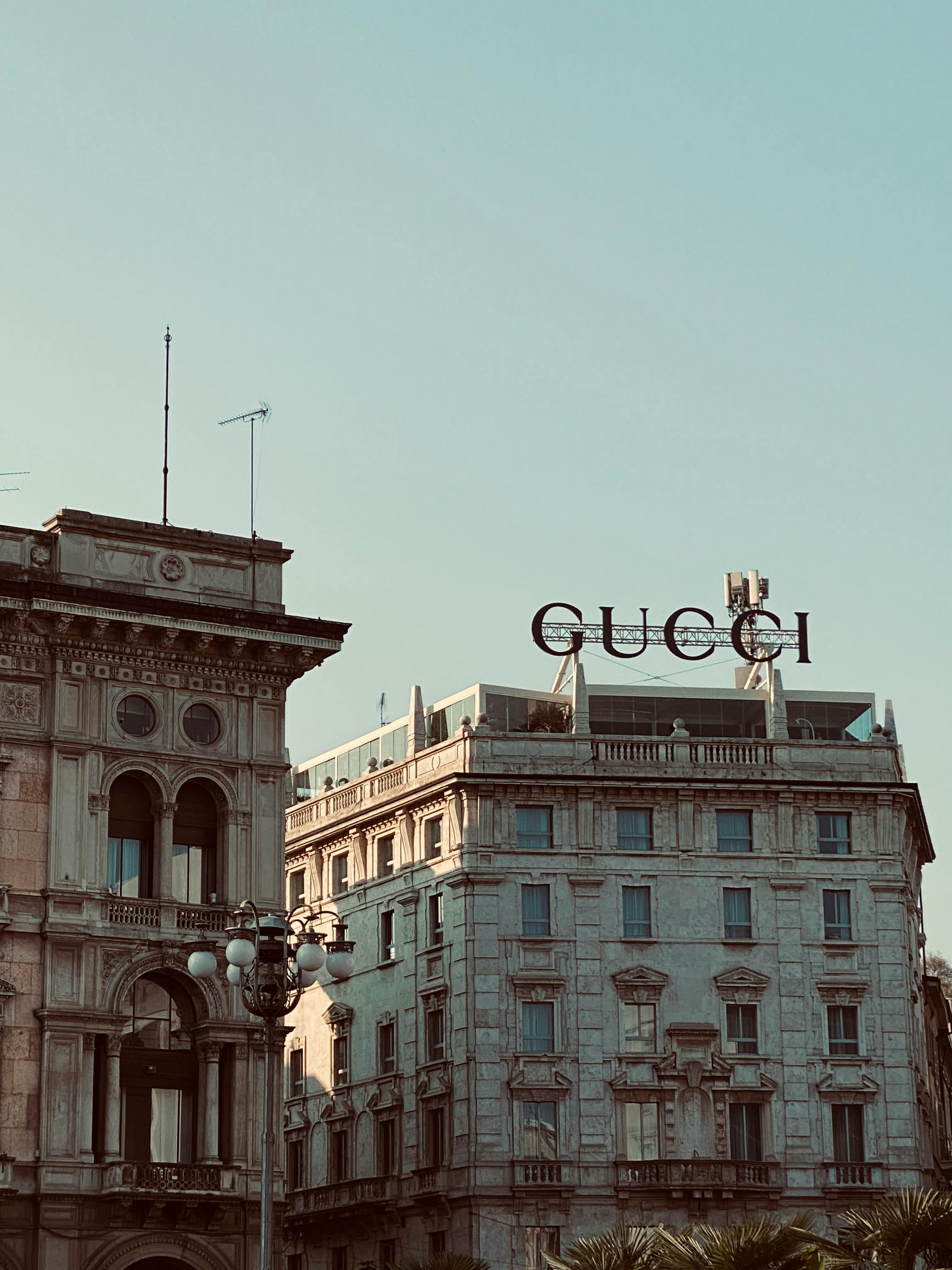 White Building with Gucci Signage · Free Stock Photo