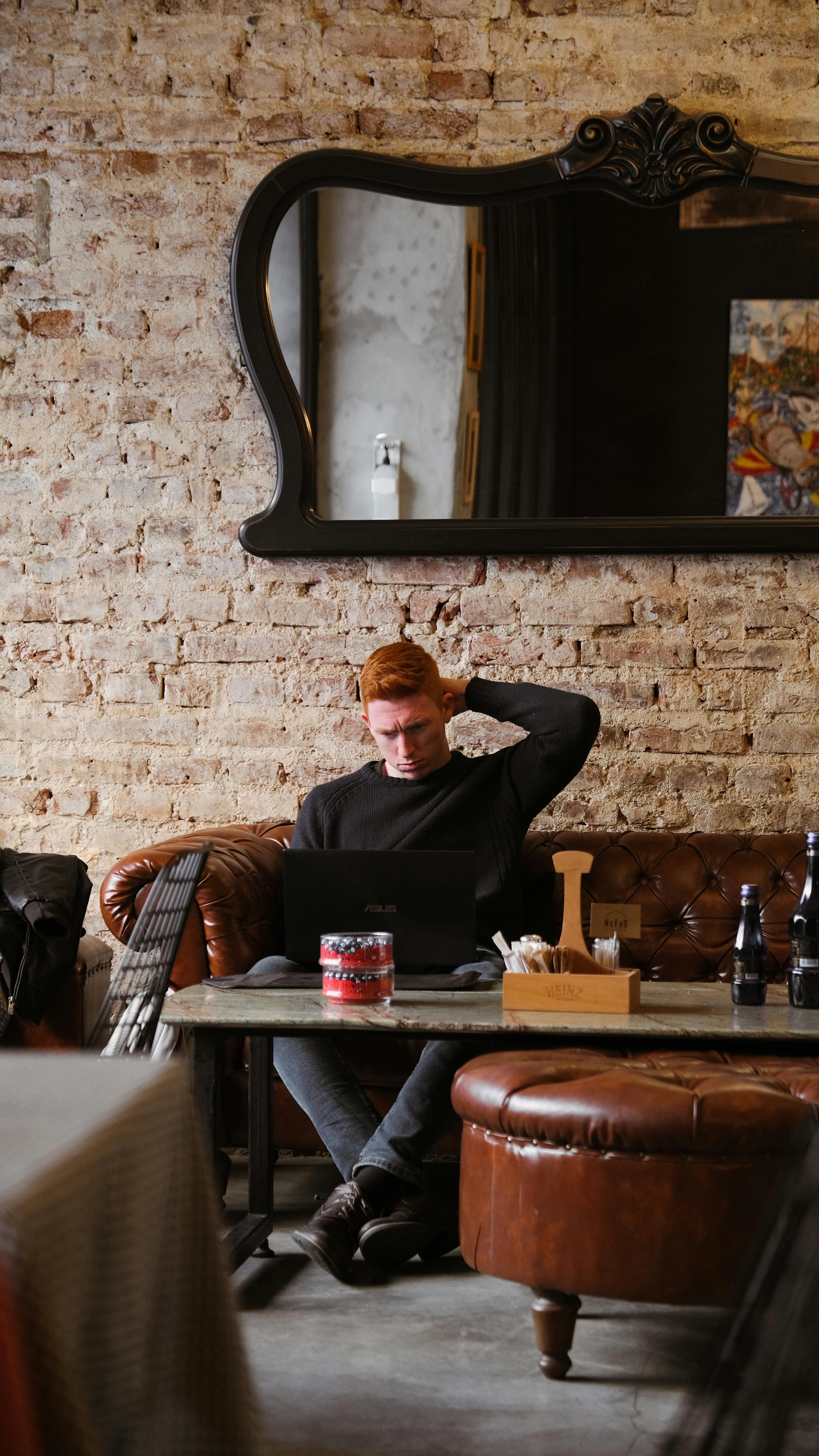 Man Sitting by Table in Retro Cafe · Free Stock Photo