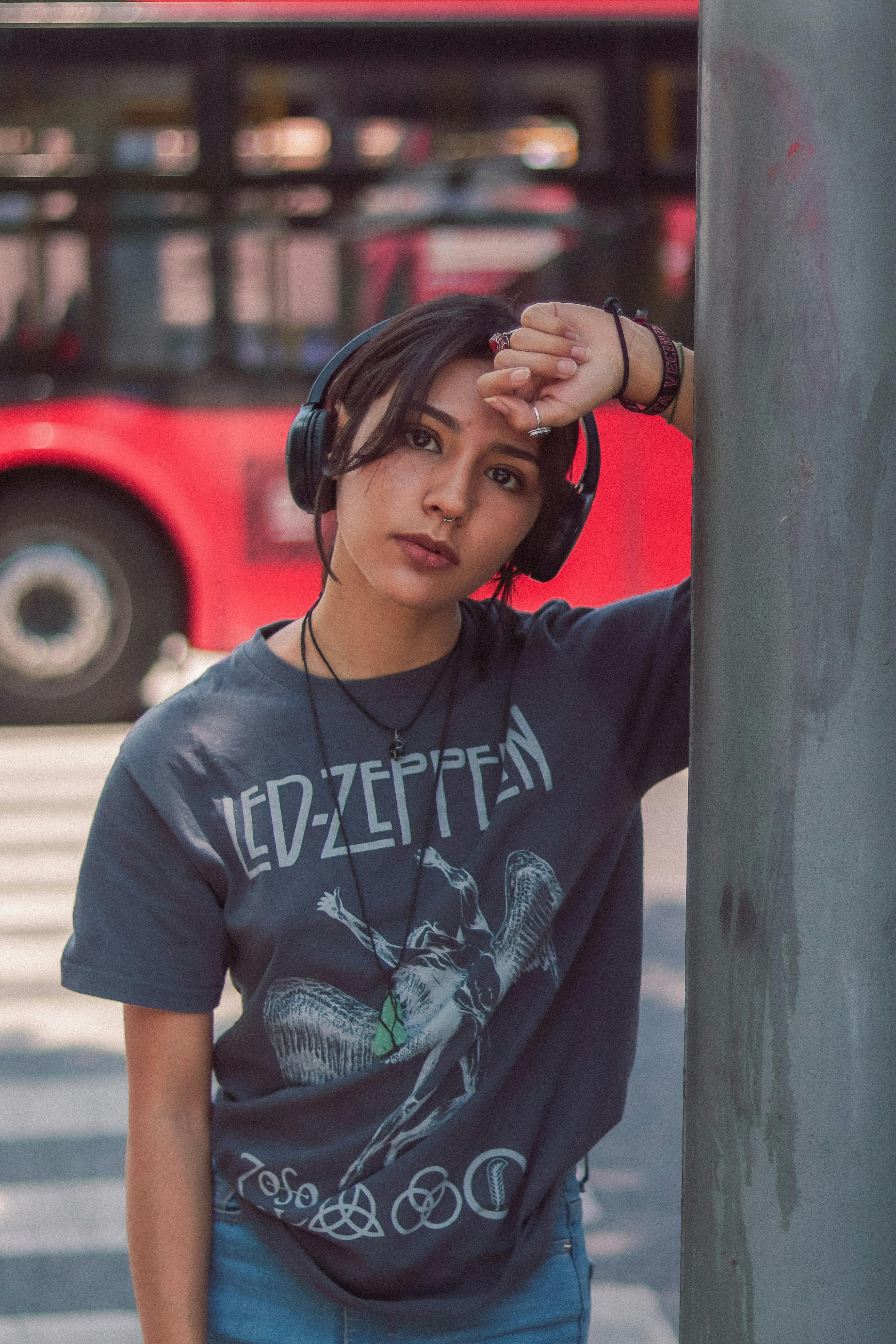 Standing Teenager Girl Wearing Headphones and Led Zeppelin T-Shirt ...