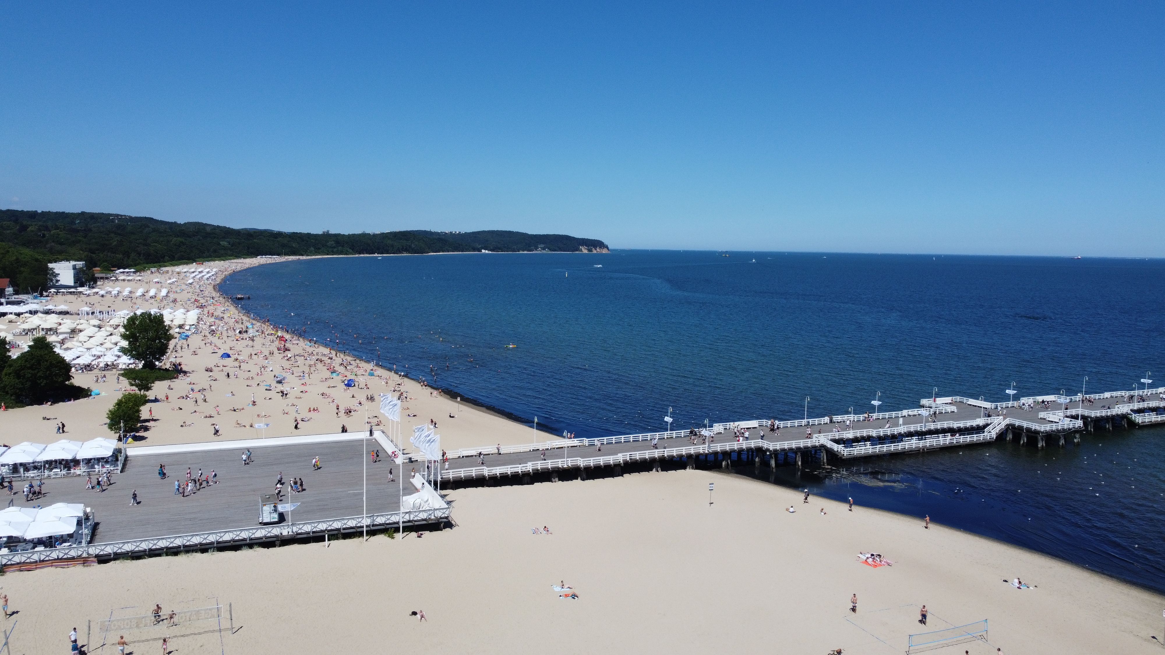 Aerial View of a Person Walking on the Pier · Free Stock Photo