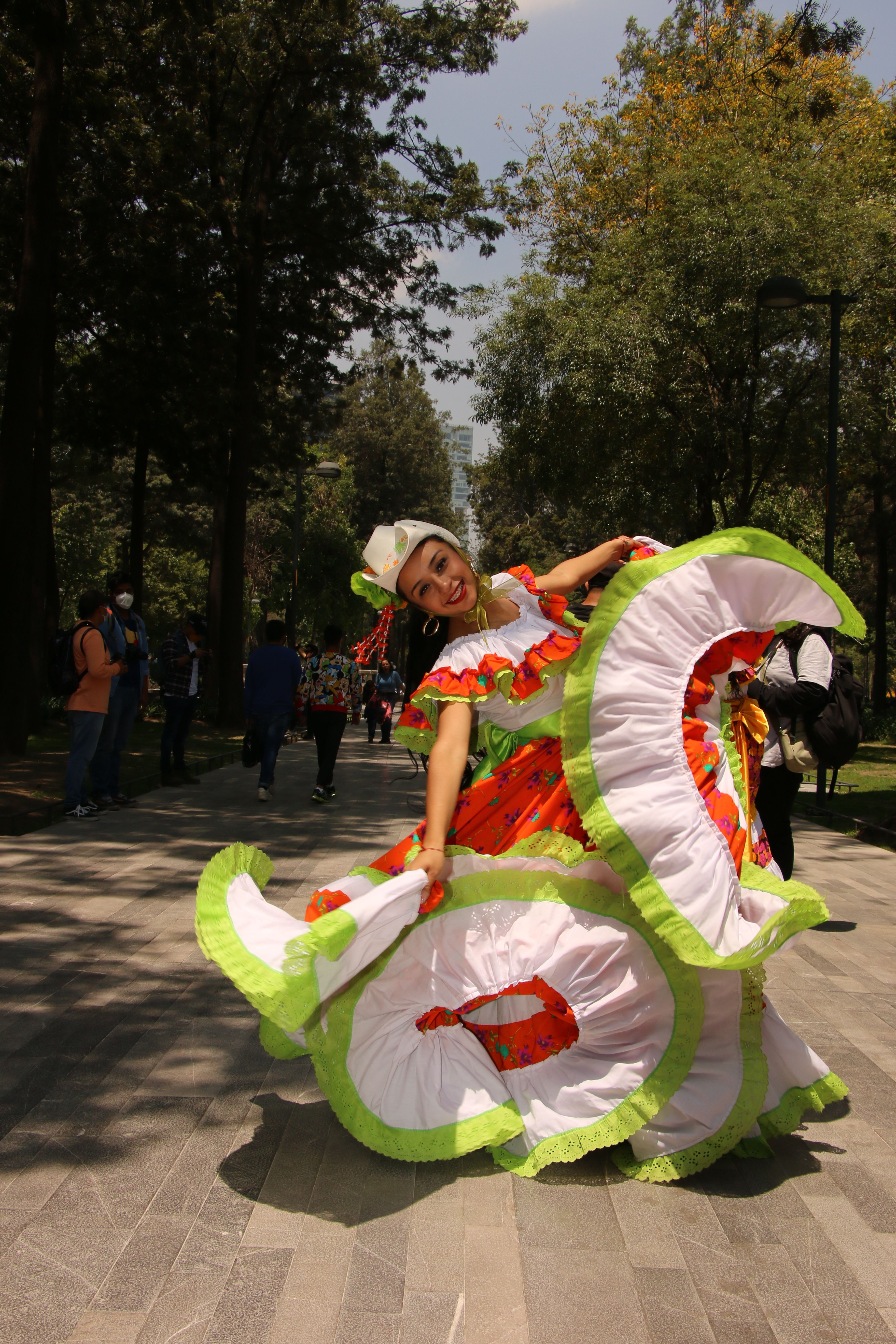 Mexican Woman in Traditional Dress Dancing on Street · Free Stock Photo