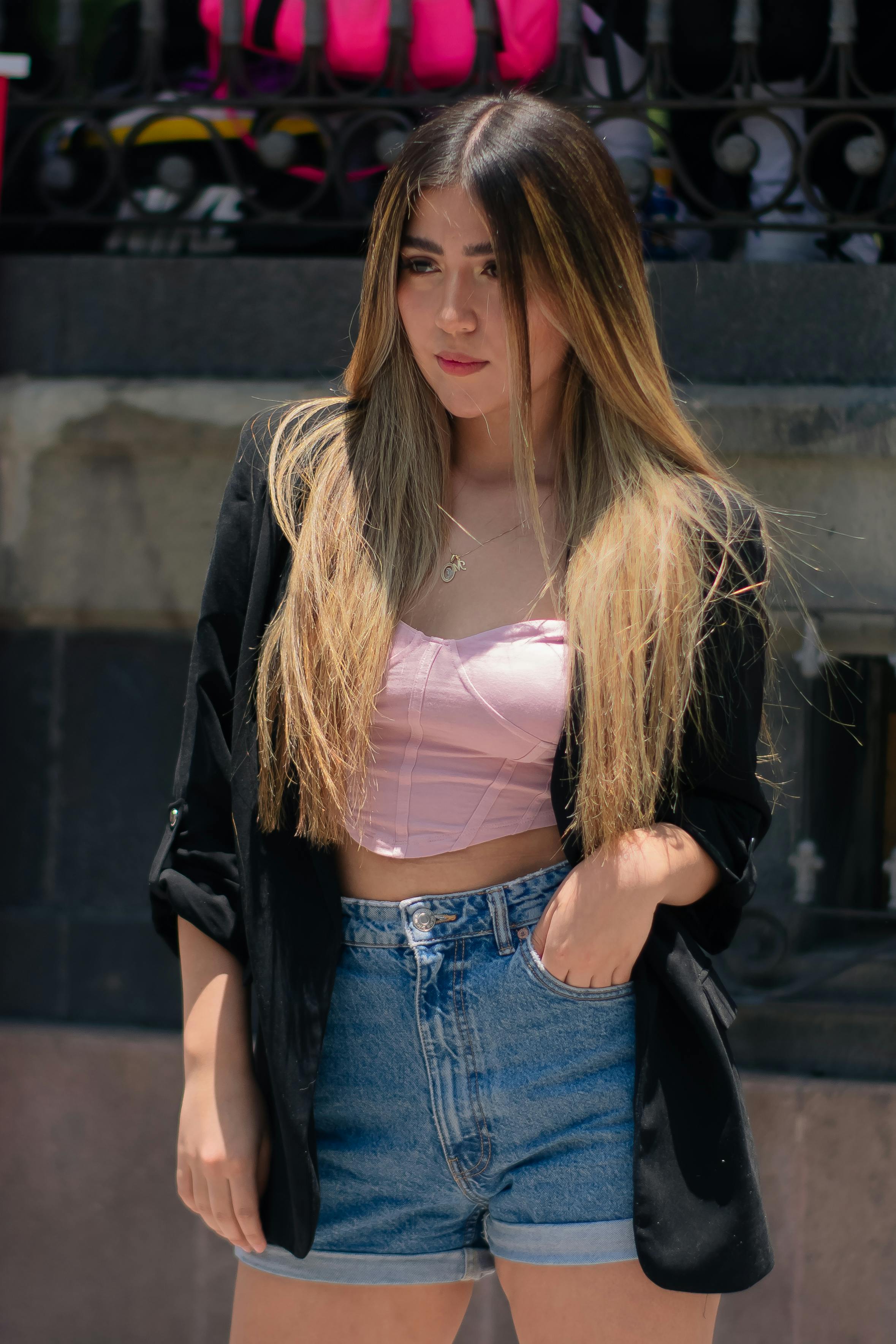 Model Posing in Denim Shorts and Boots · Free Stock Photo