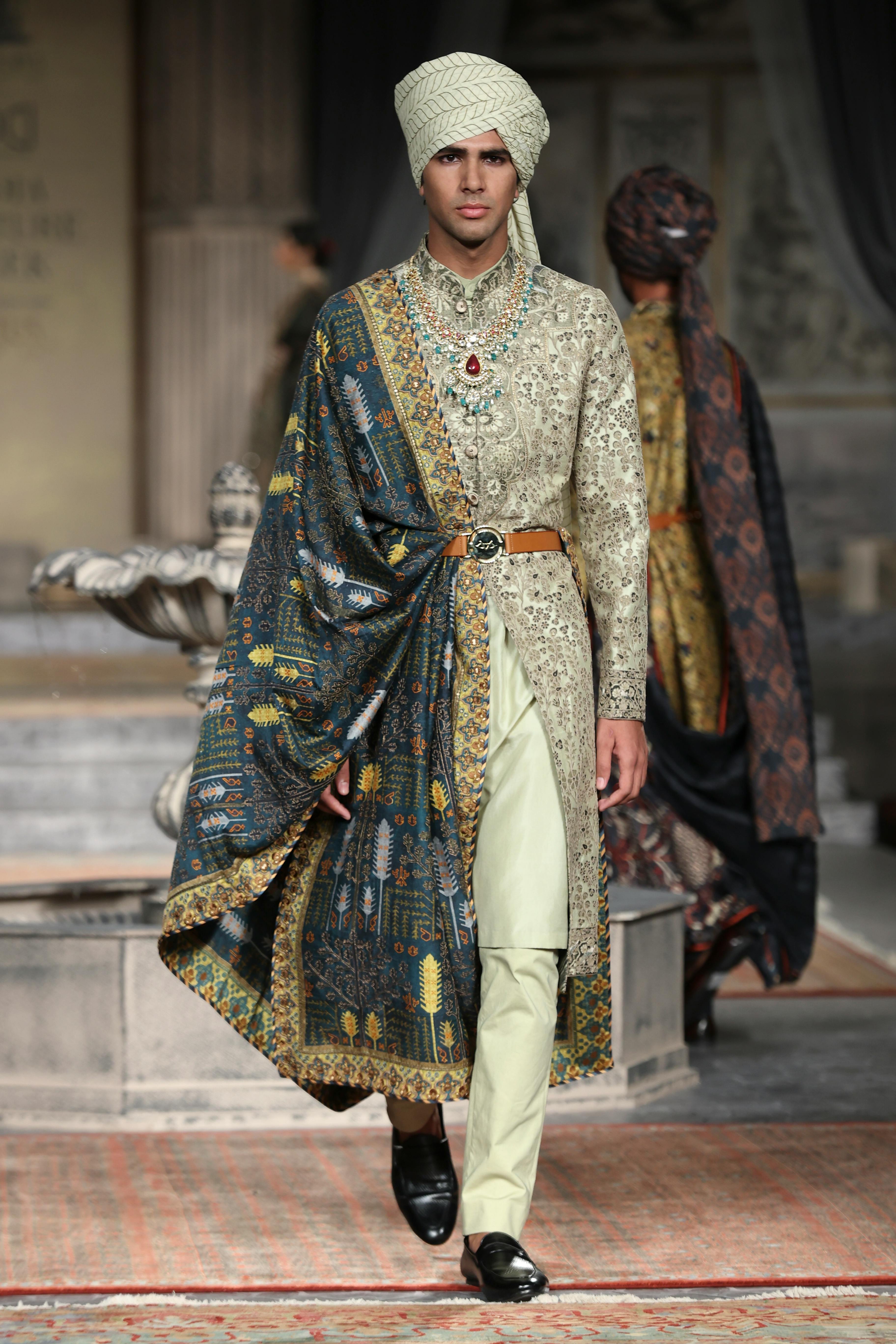Man in Traditional Indian Costume Walking on Runway · Free Stock Photo