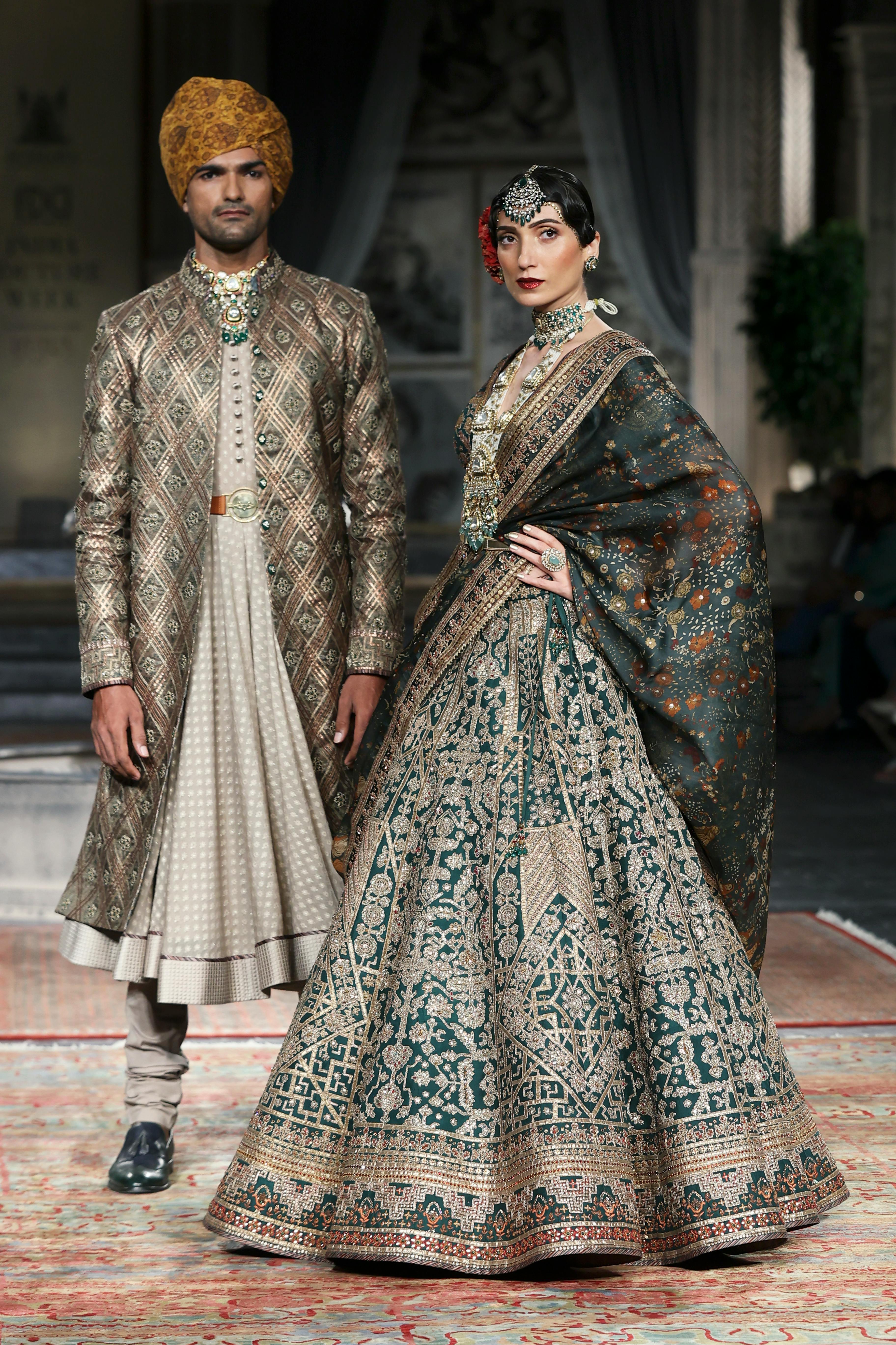 A Man and a Woman Modeling Elegant Outfits · Free Stock Photo