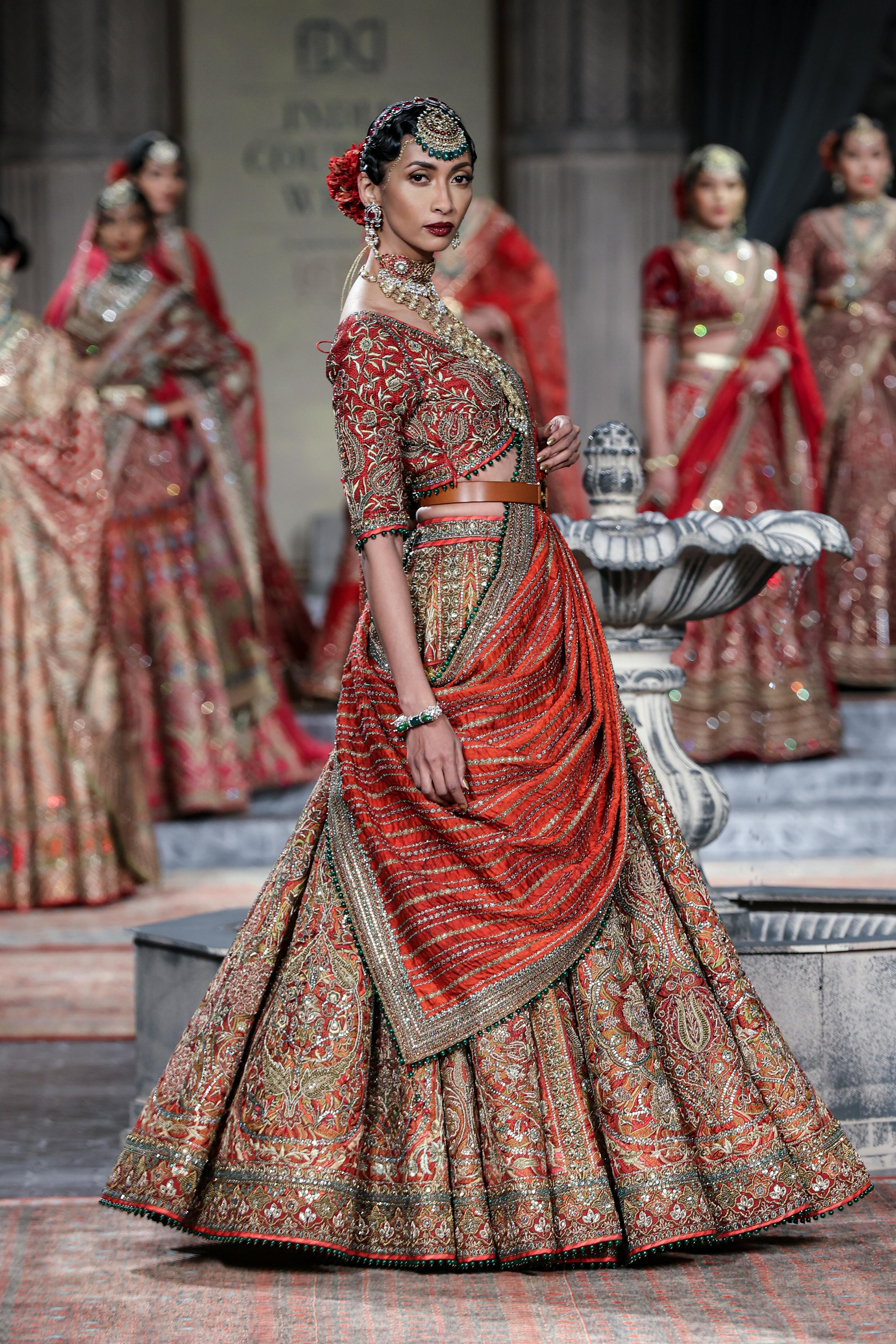 Model Standing in Traditional Dress · Free Stock Photo