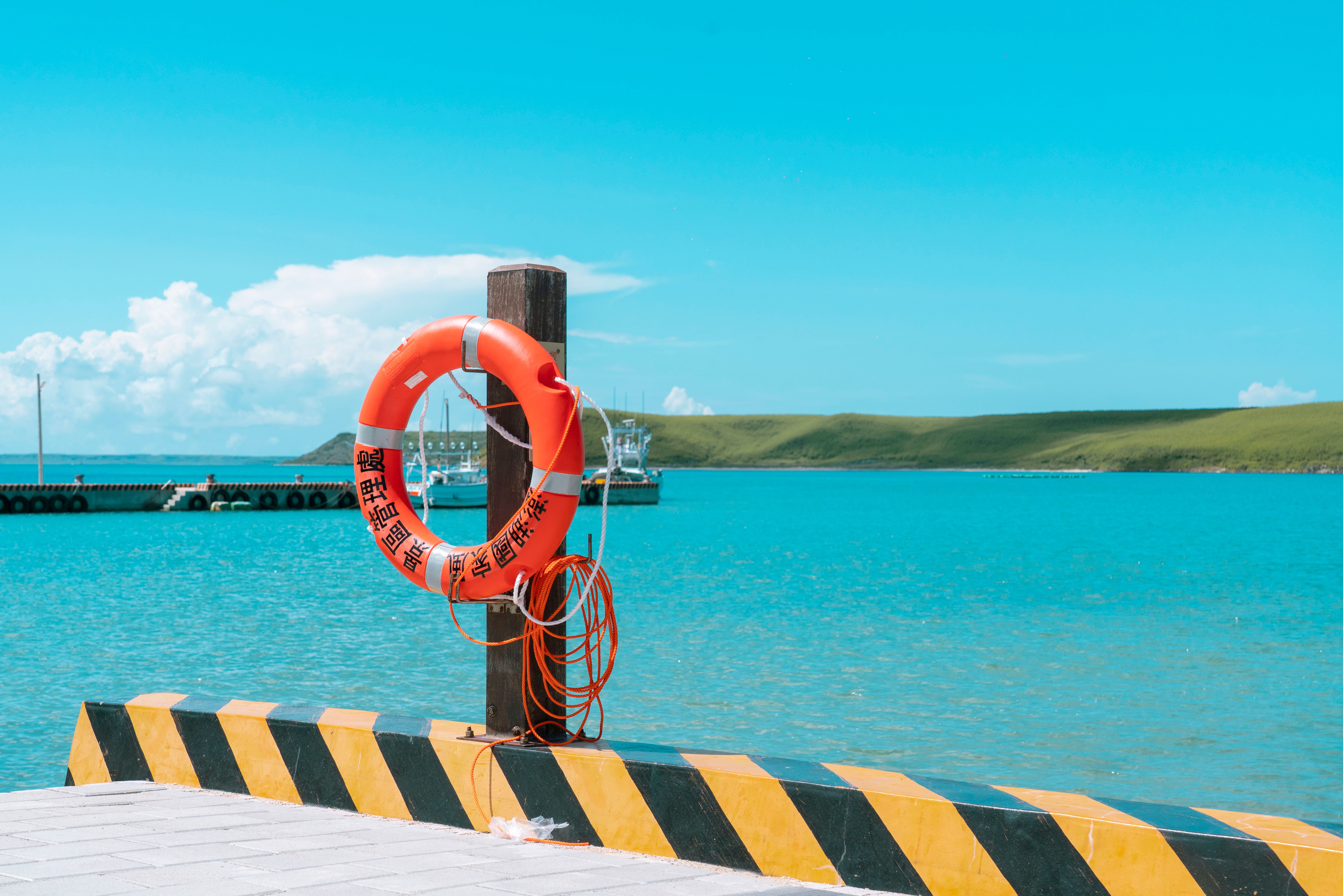 Life Buoy on a Pier Pole · Free Stock Photo