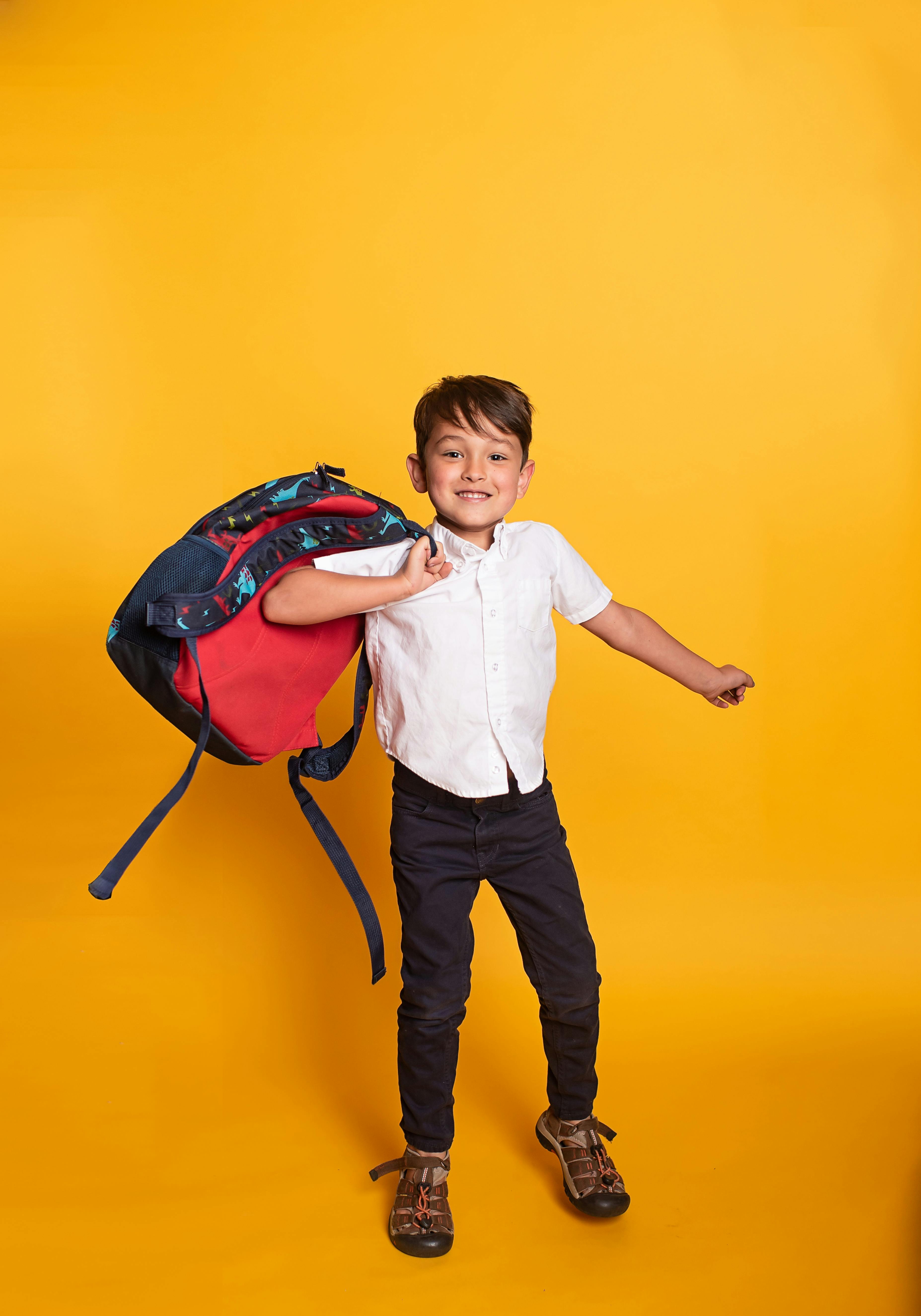Person Holding Black Backpack · Free Stock Photo