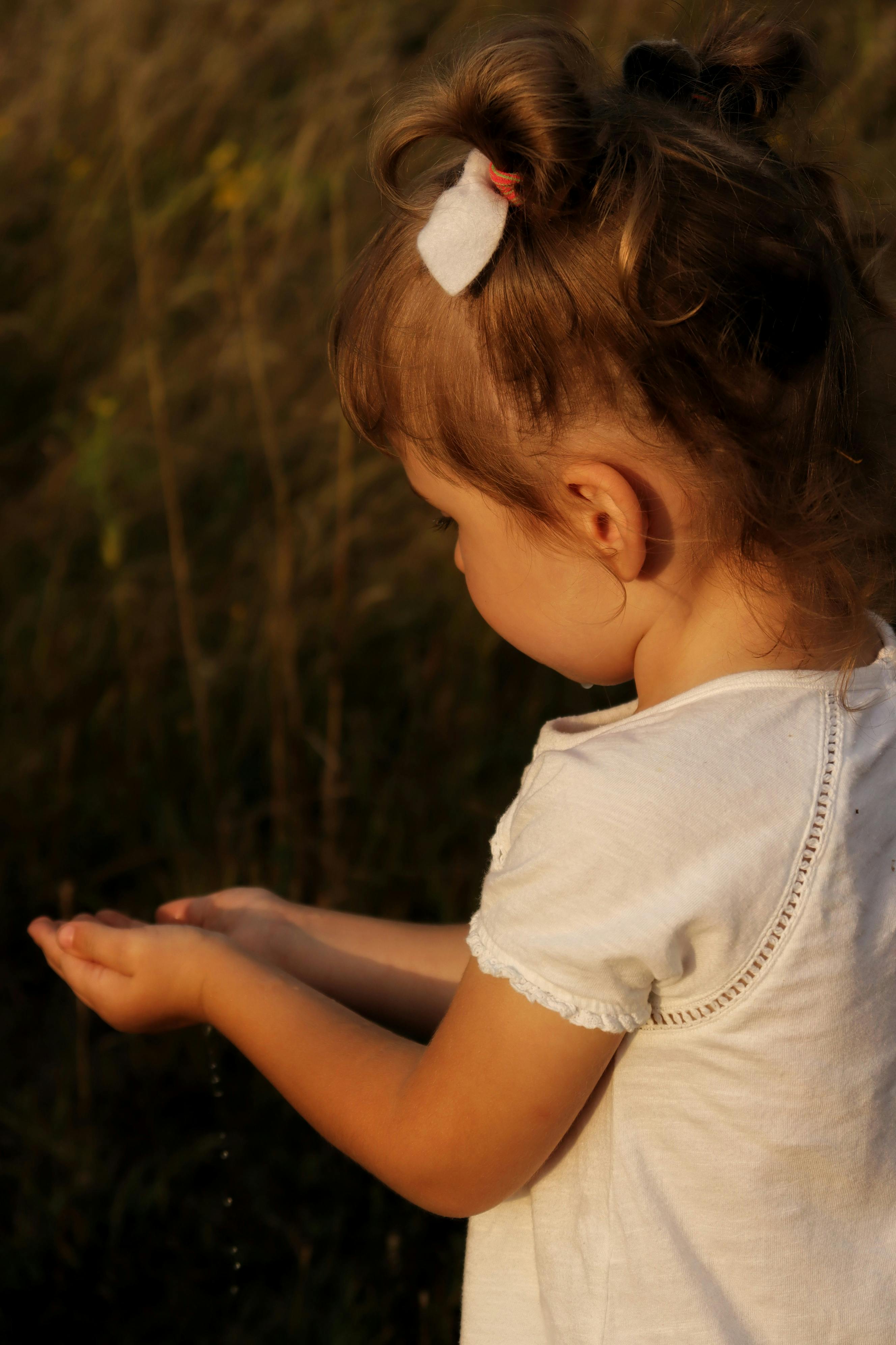 Close up of a Child Being Baptized · Free Stock Photo