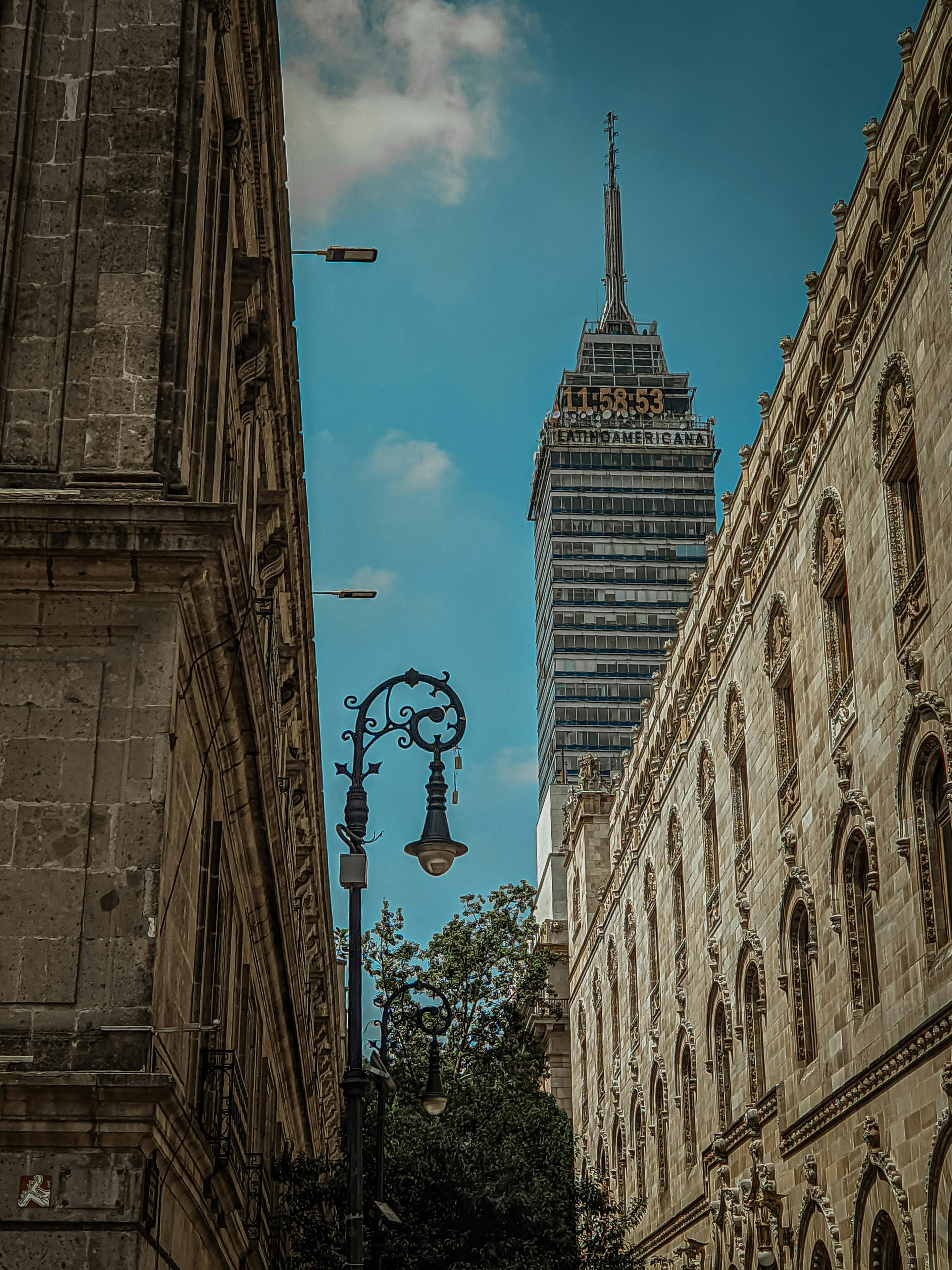 Skyscraper in Skyline Above Street · Free Stock Photo