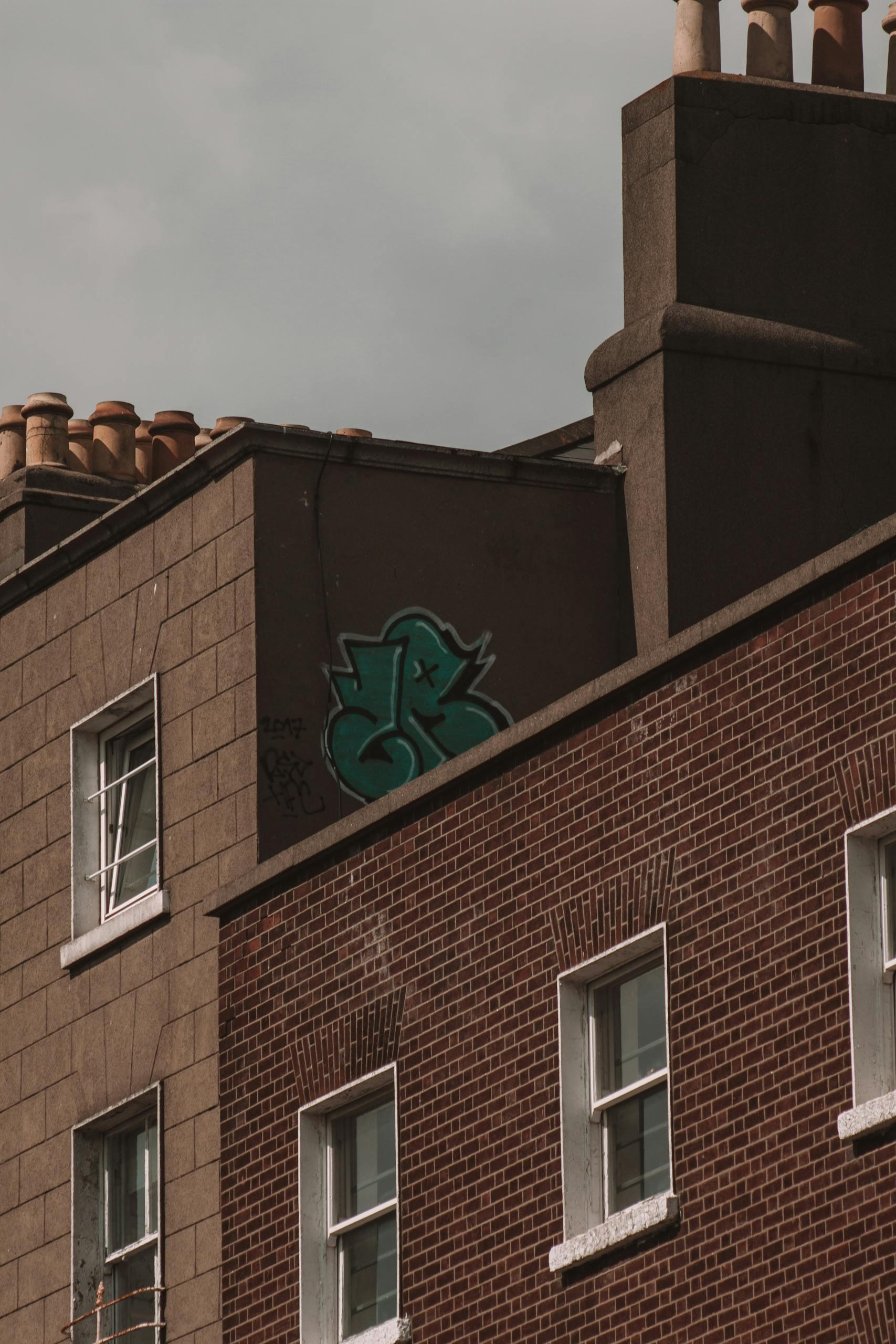 Residential Building Facade with Graffiti · Free Stock Photo