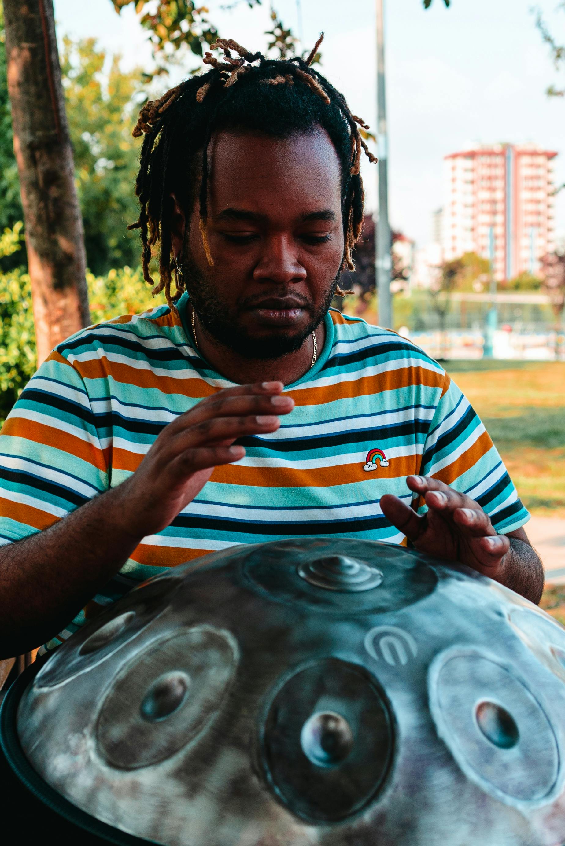 A Man Playing a Handpan · Free Stock Photo