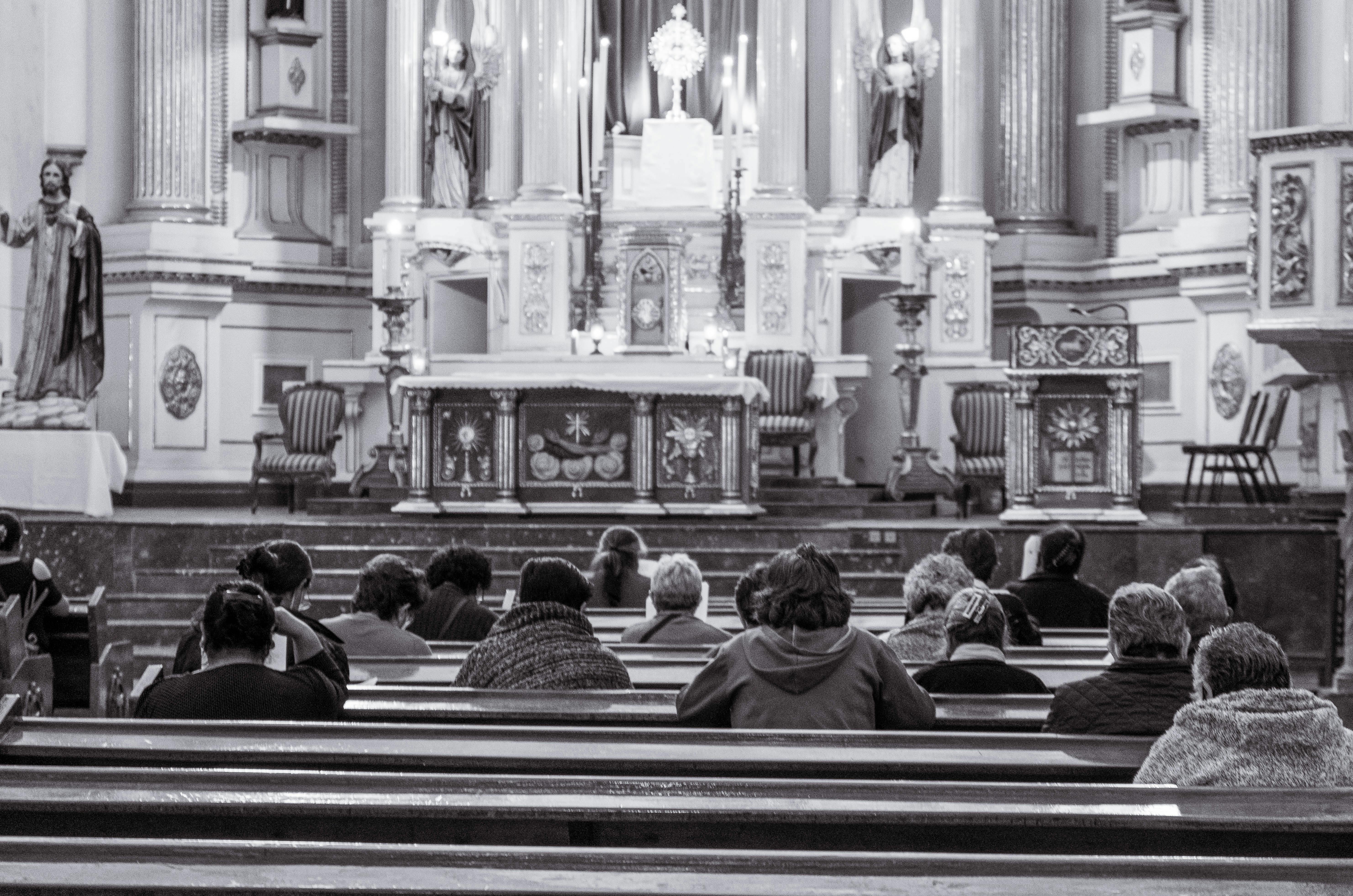 Grayscale Photo of People Sitting Inside Church · Free Stock Photo
