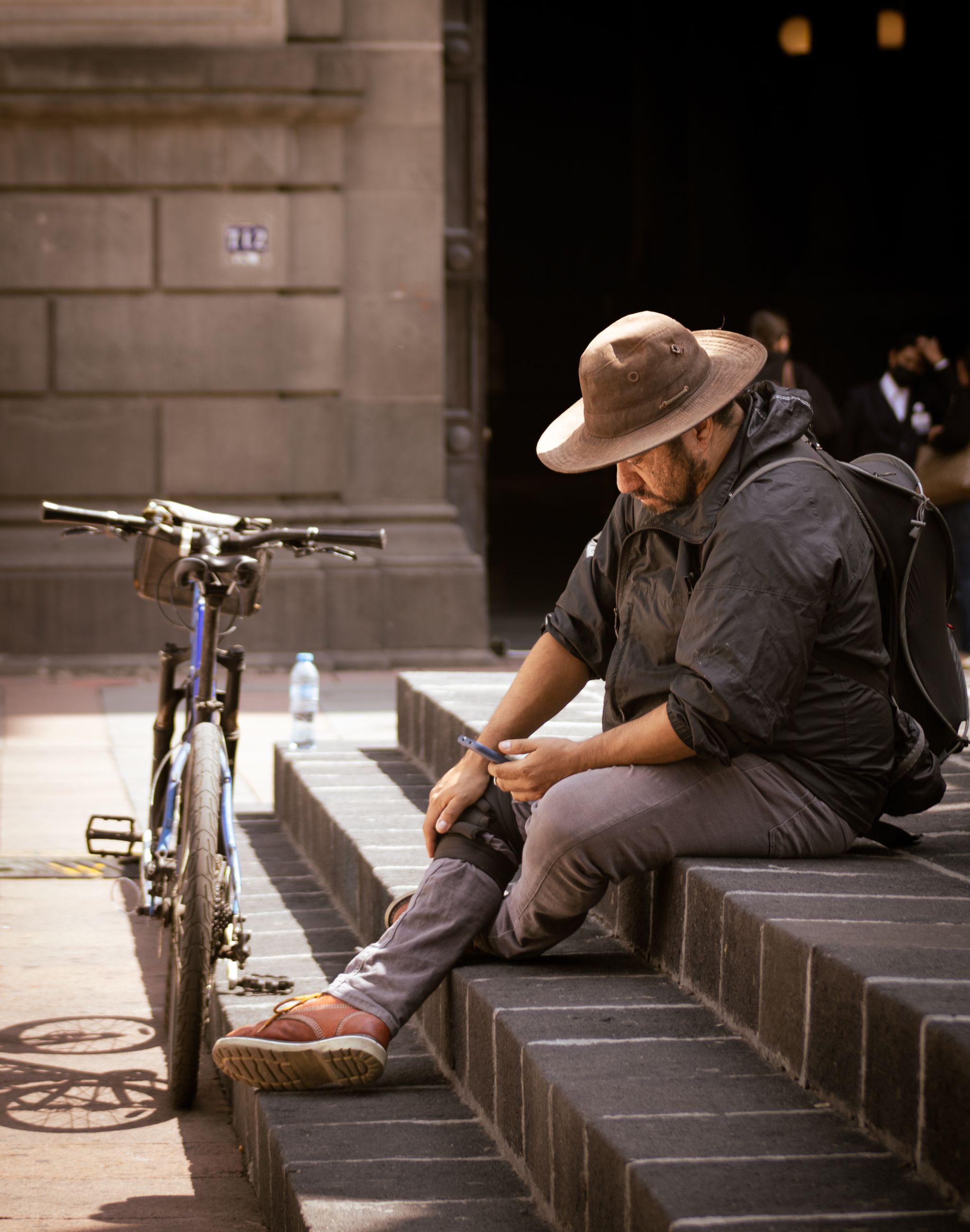 Man Sitting on Steps · Free Stock Photo