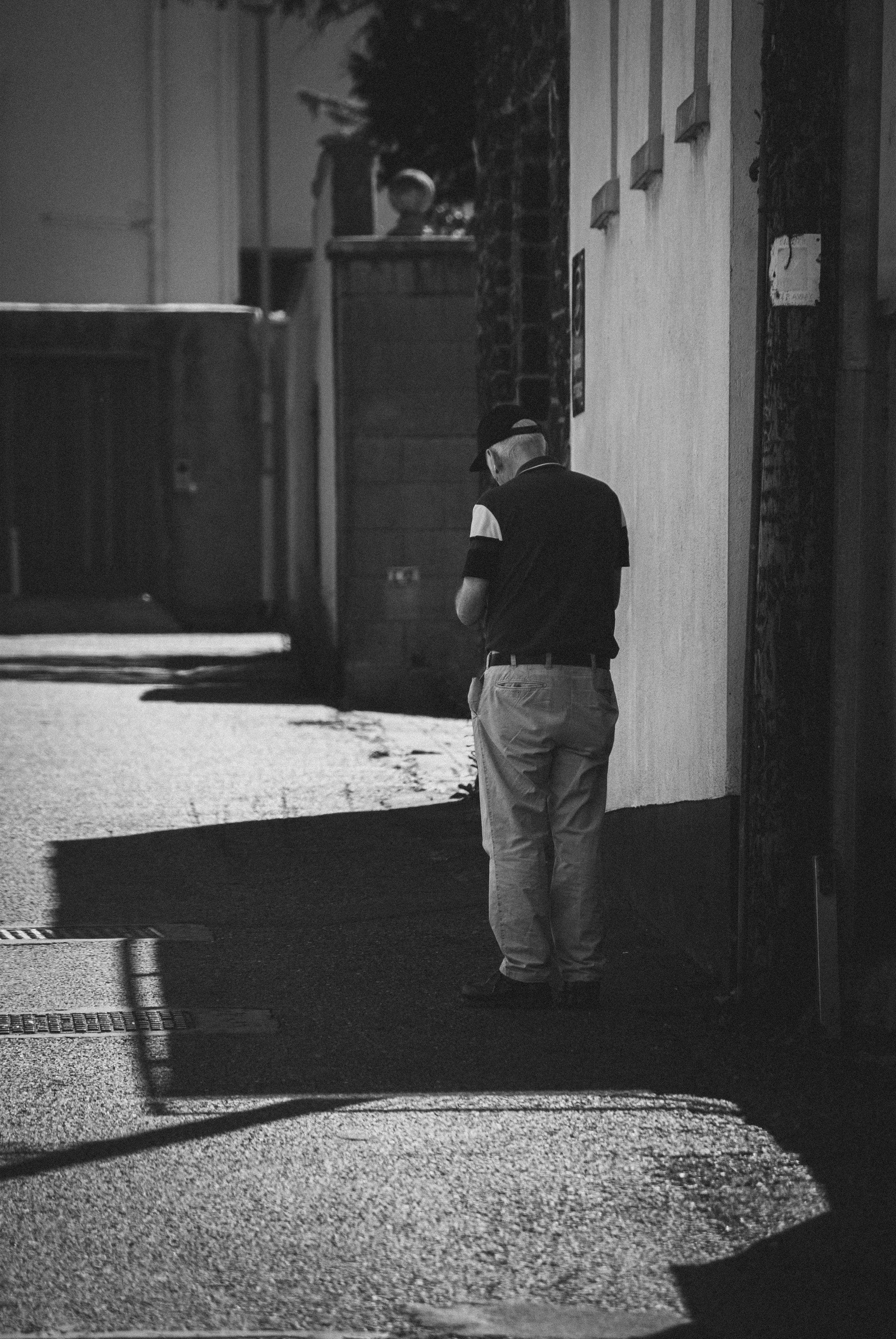 Back View of a Man Standing Under a Shadow · Free Stock Photo