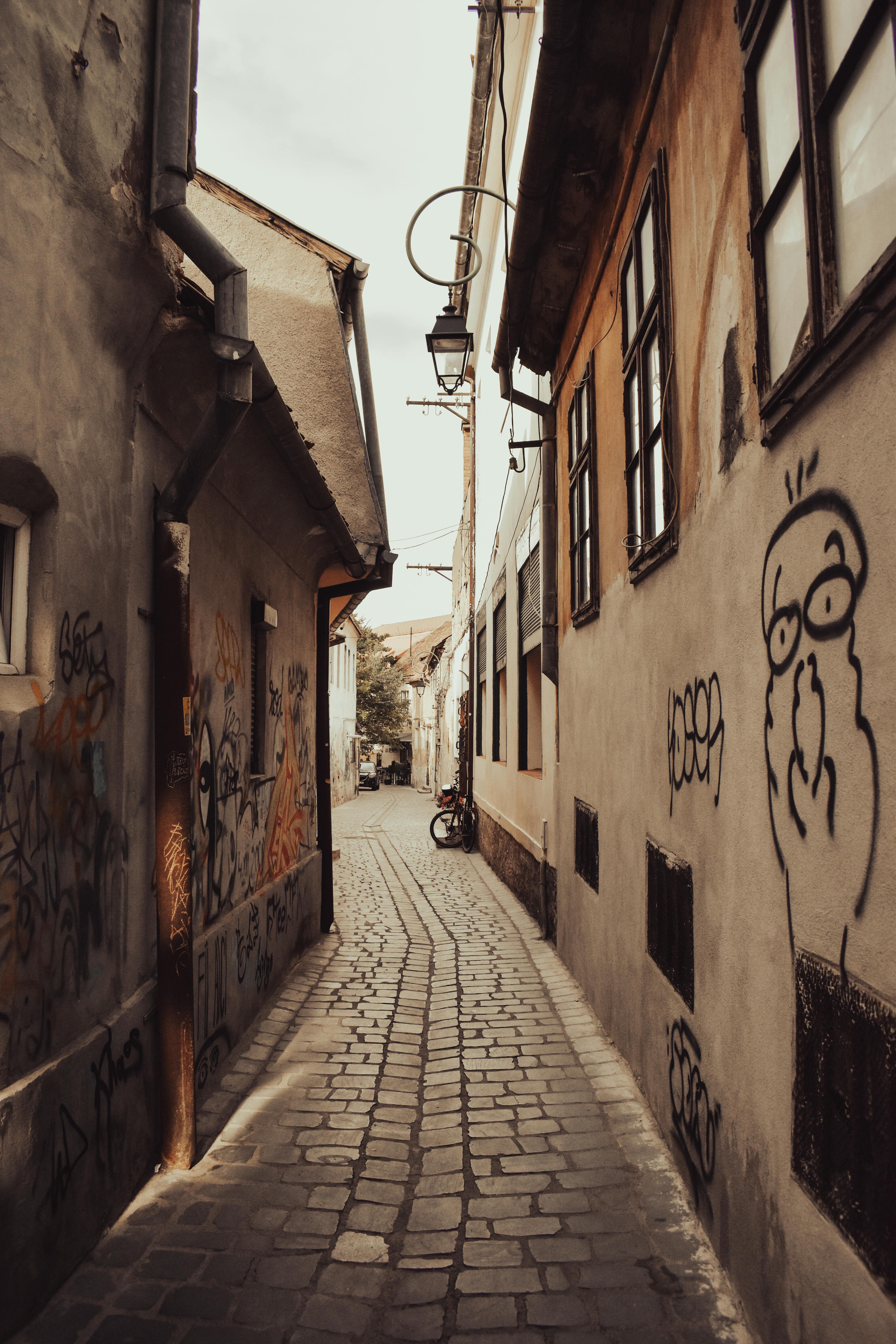 Cafe Tables in Narrow Passage · Free Stock Photo