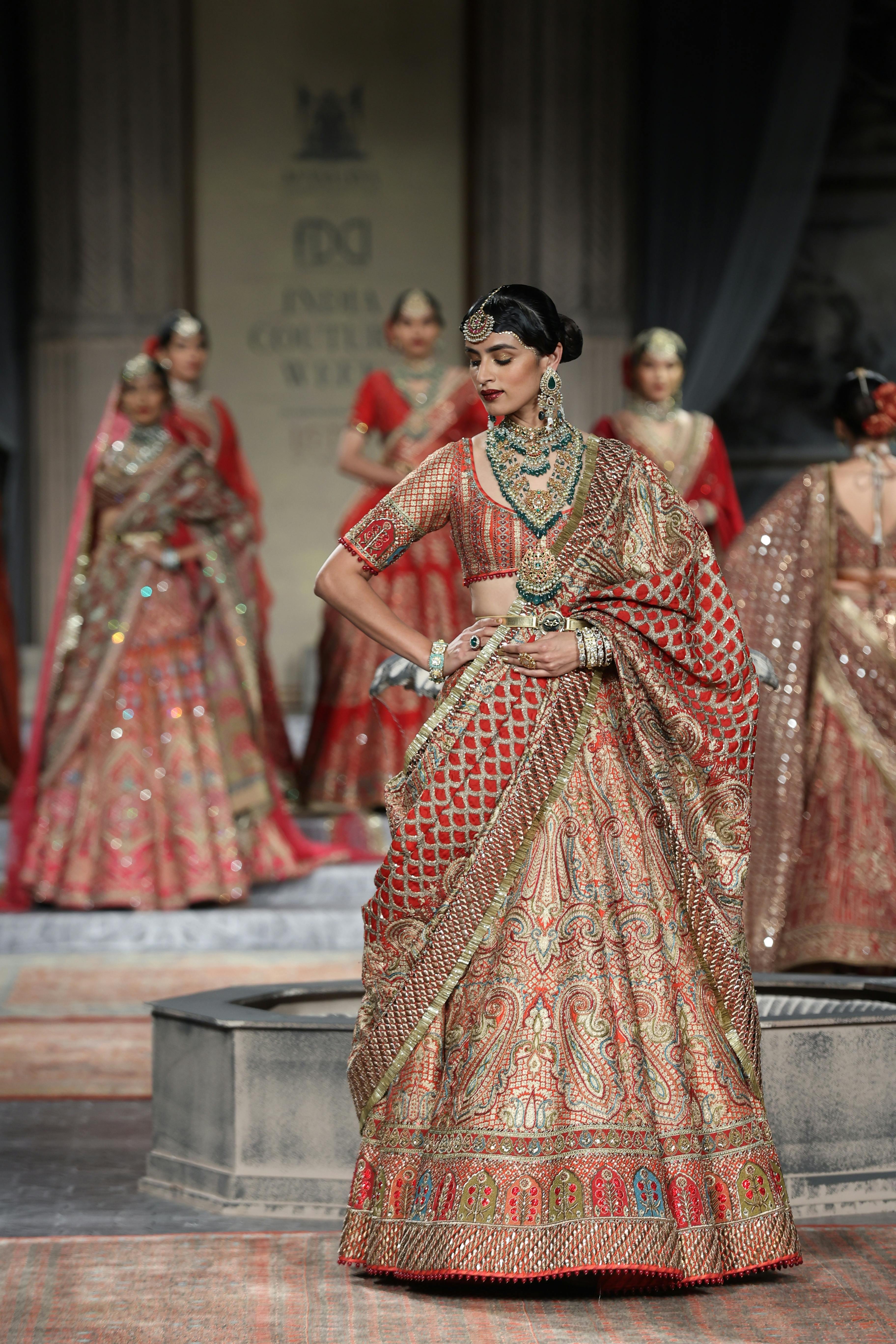 Models Wearing Traditional Sari Dress in a Fashion Show · Free Stock Photo