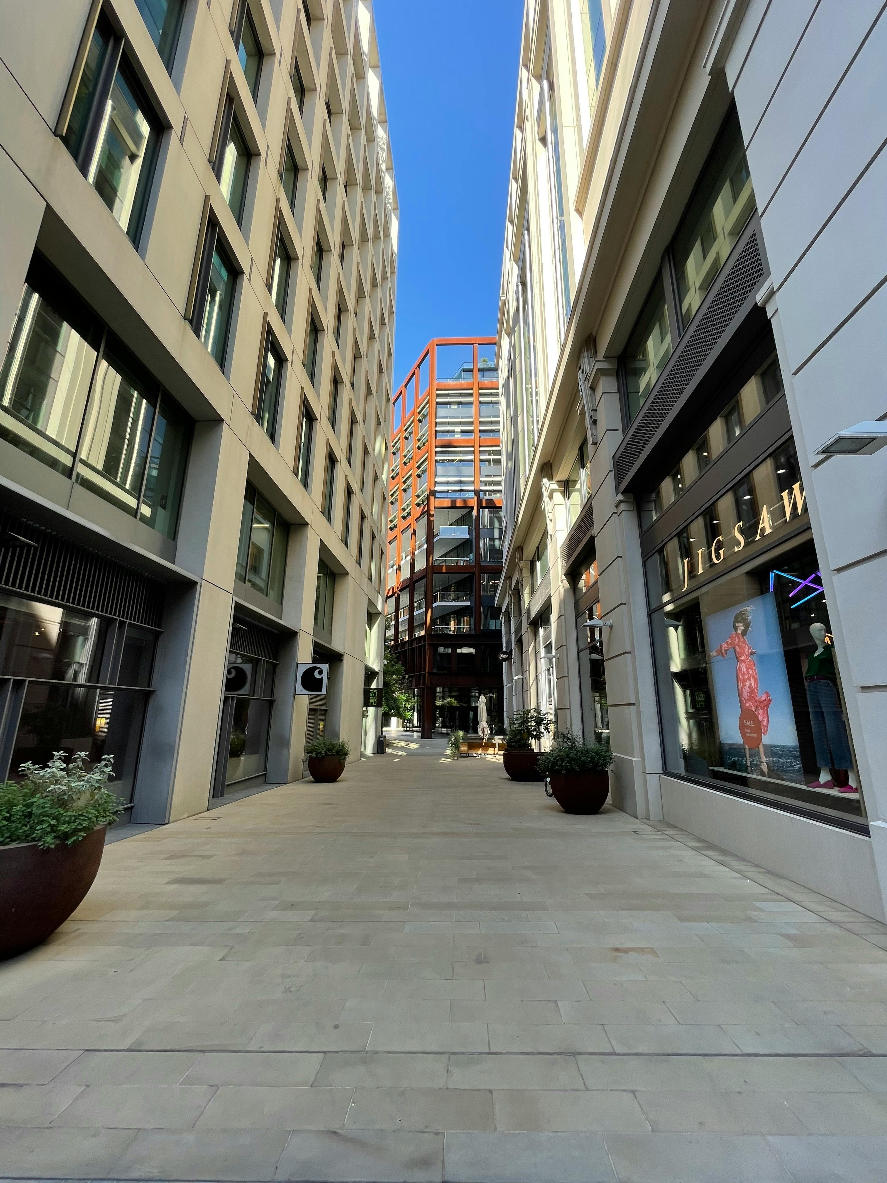 Narrow Street between City Buildings · Free Stock Photo