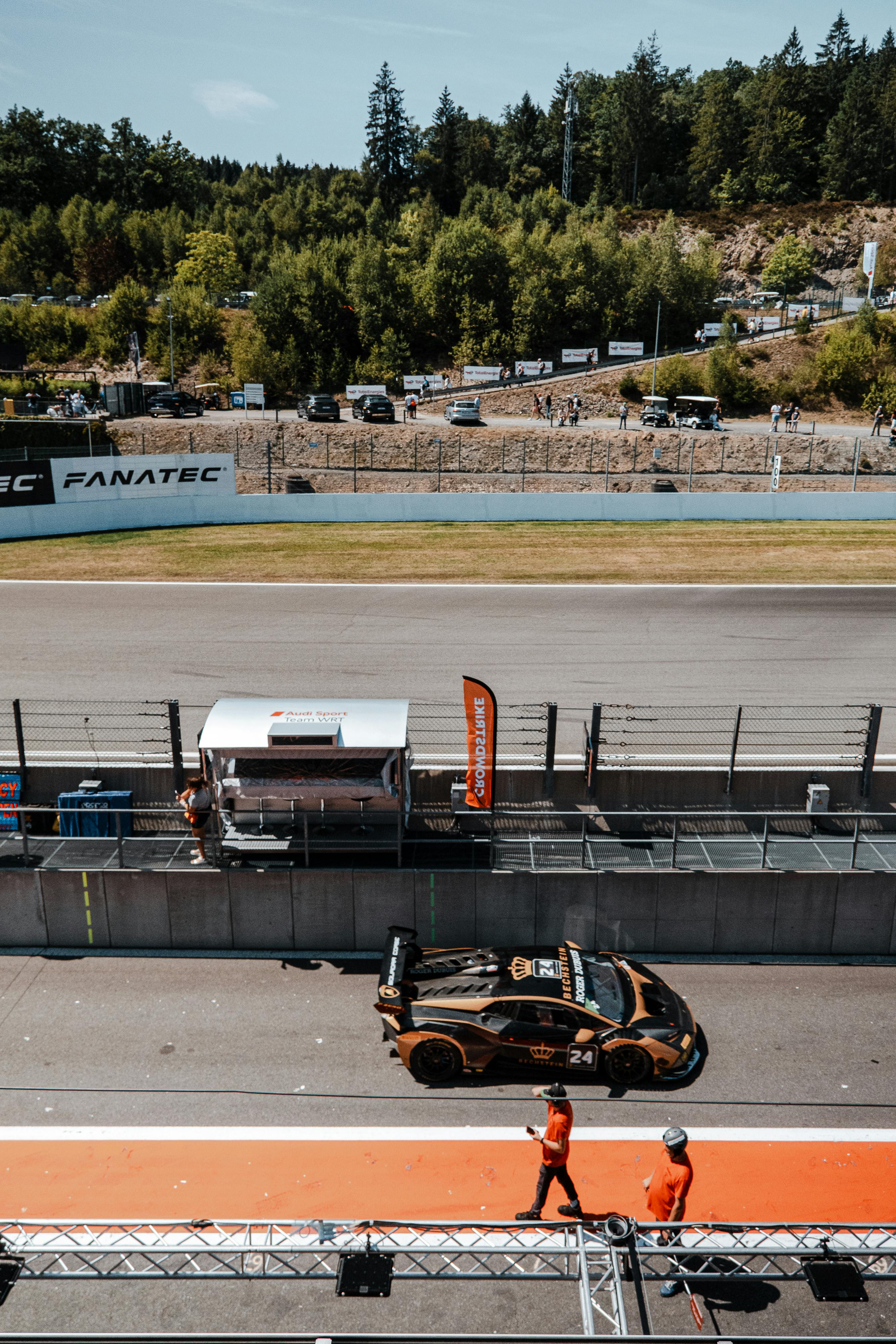 A Brown Racing Car on the Race Track · Free Stock Photo