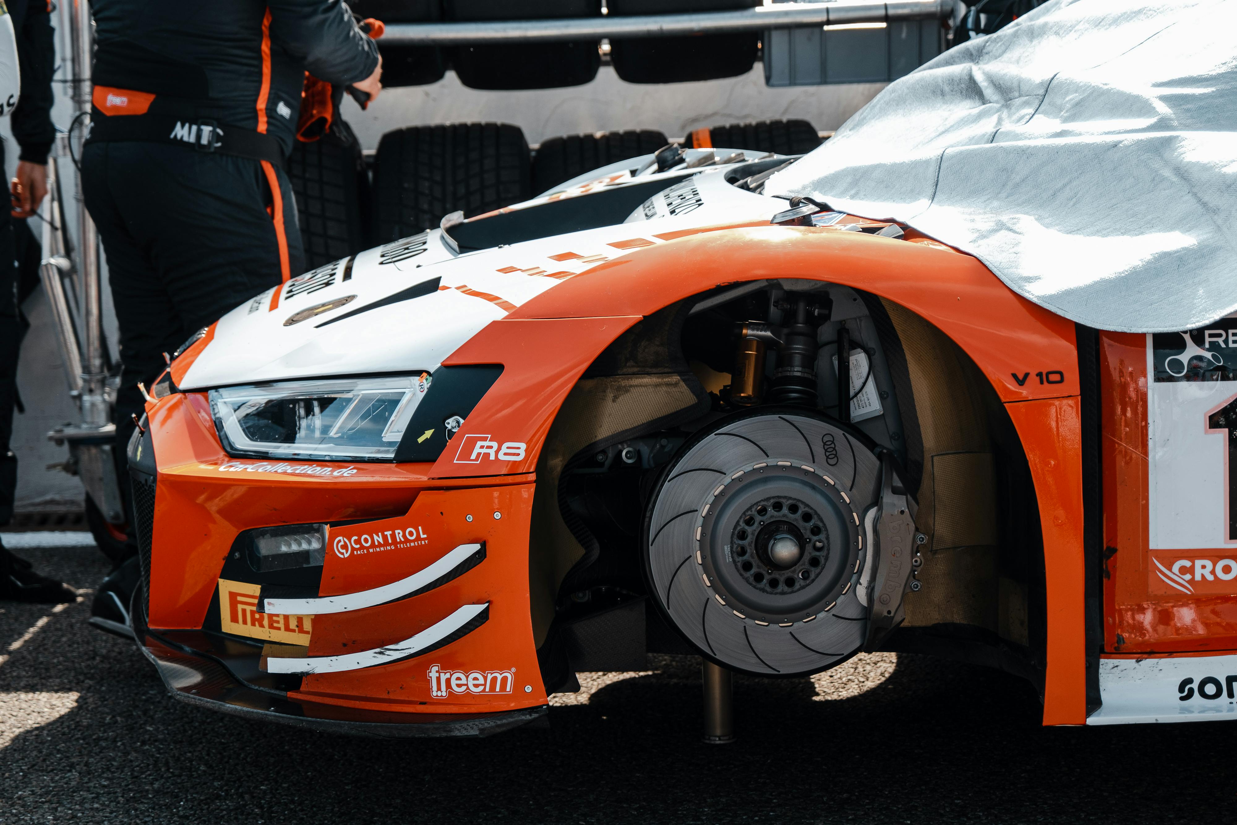 An Orange Tireless Racing Car · Free Stock Photo