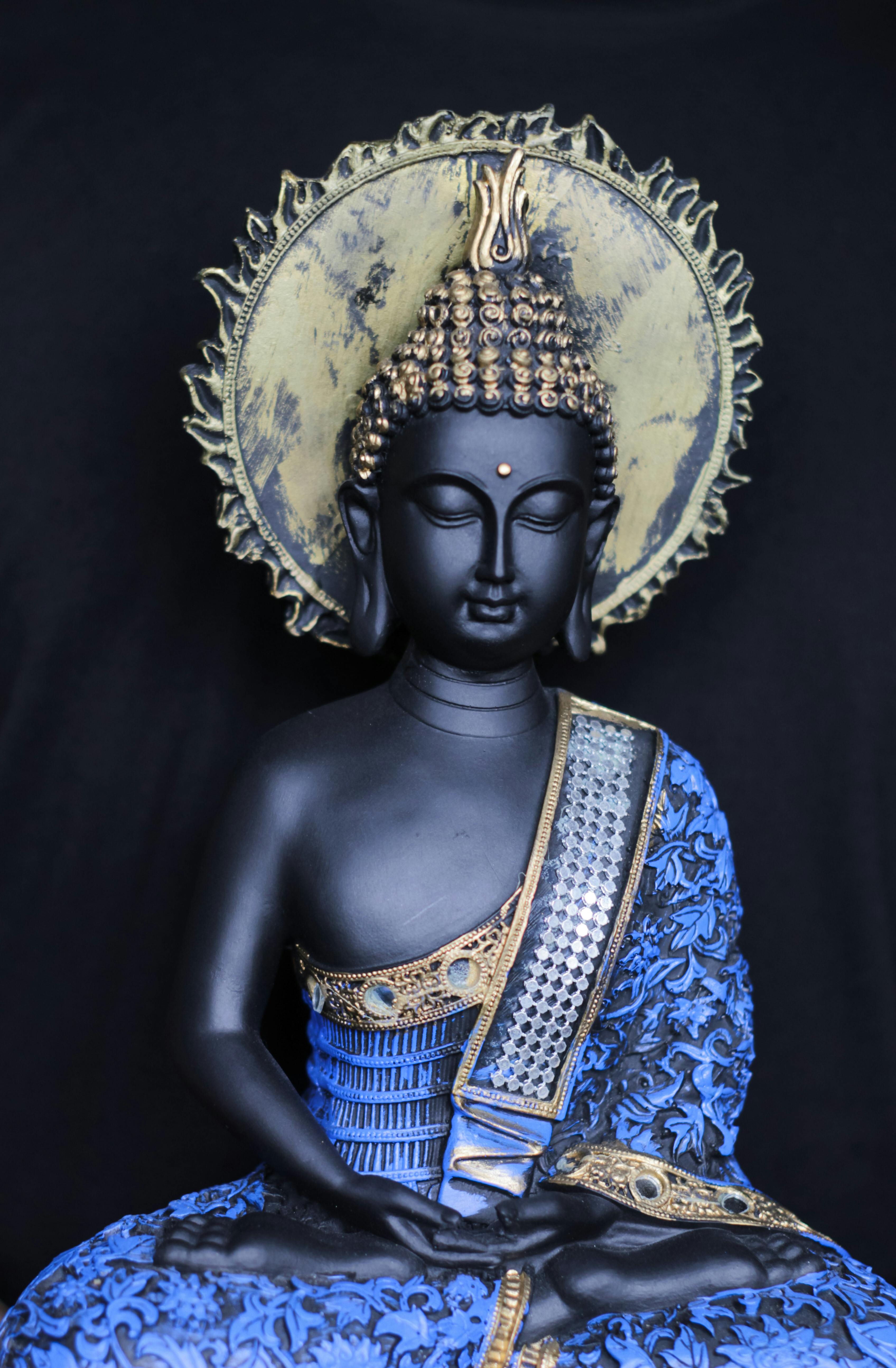 A Gray Buddha on Dark Background · Free Stock Photo