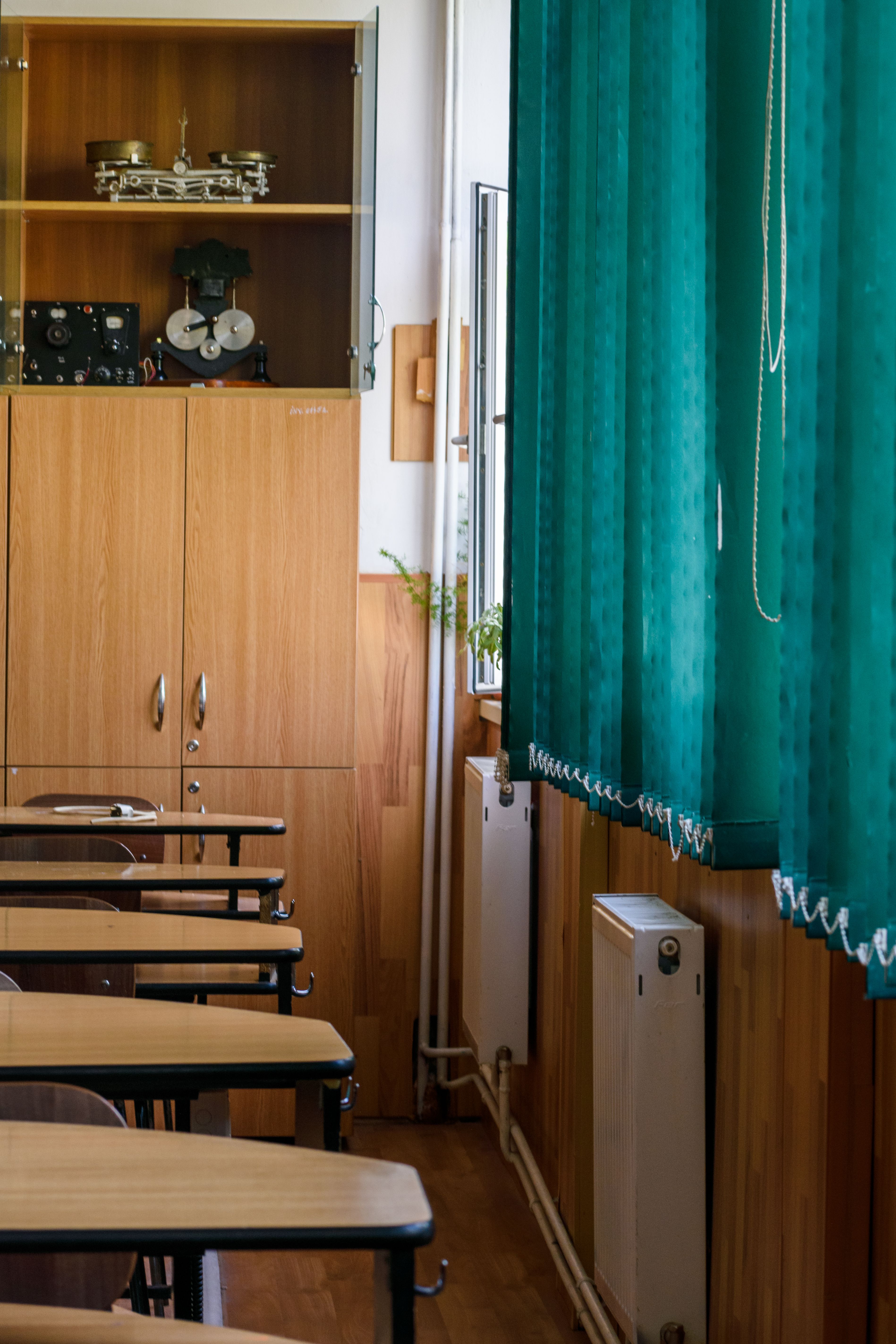 Classroom Interior with Desks and Radiators · Free Stock Photo